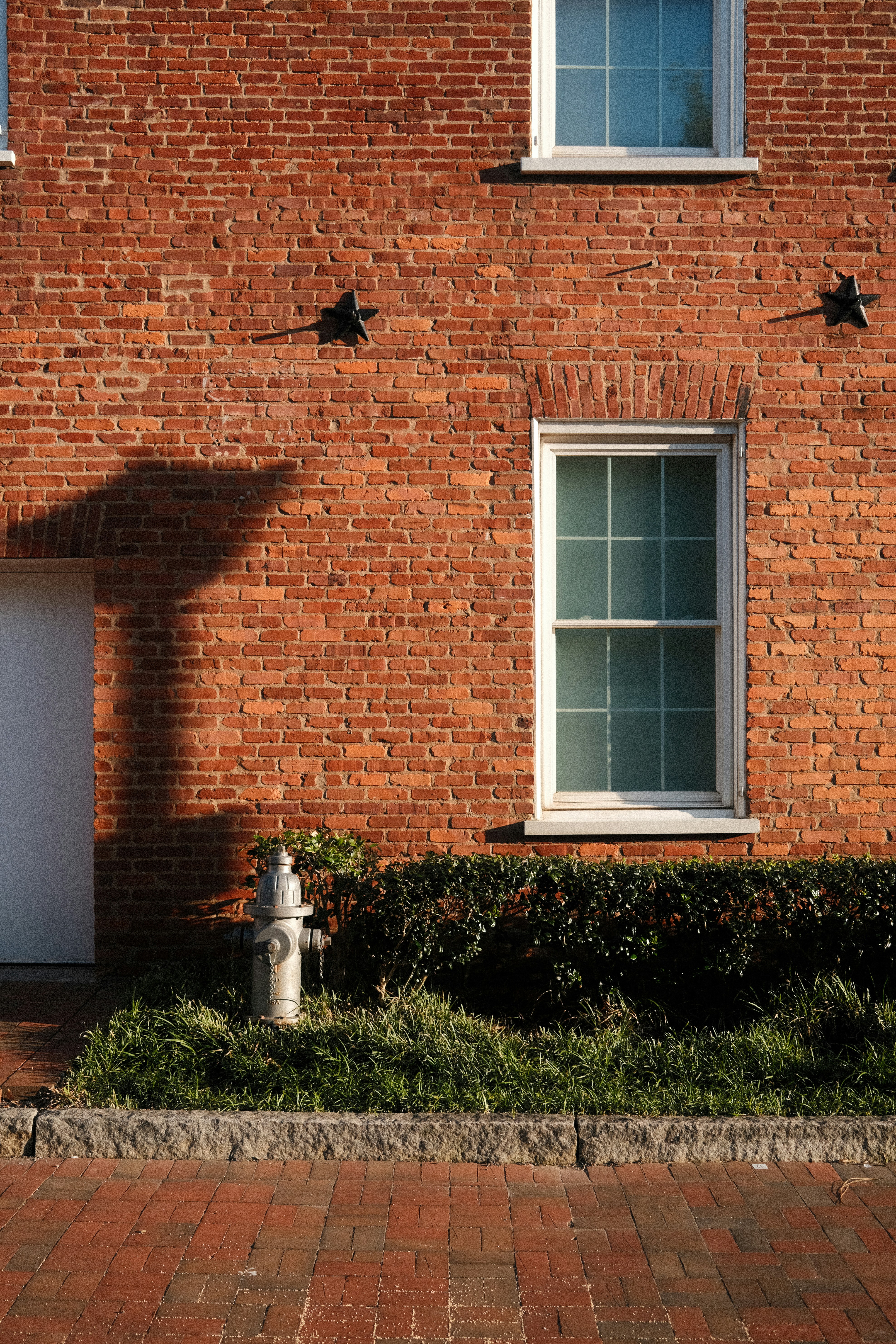 Brick Facade with Shadowed Accent and Fire Hydrant