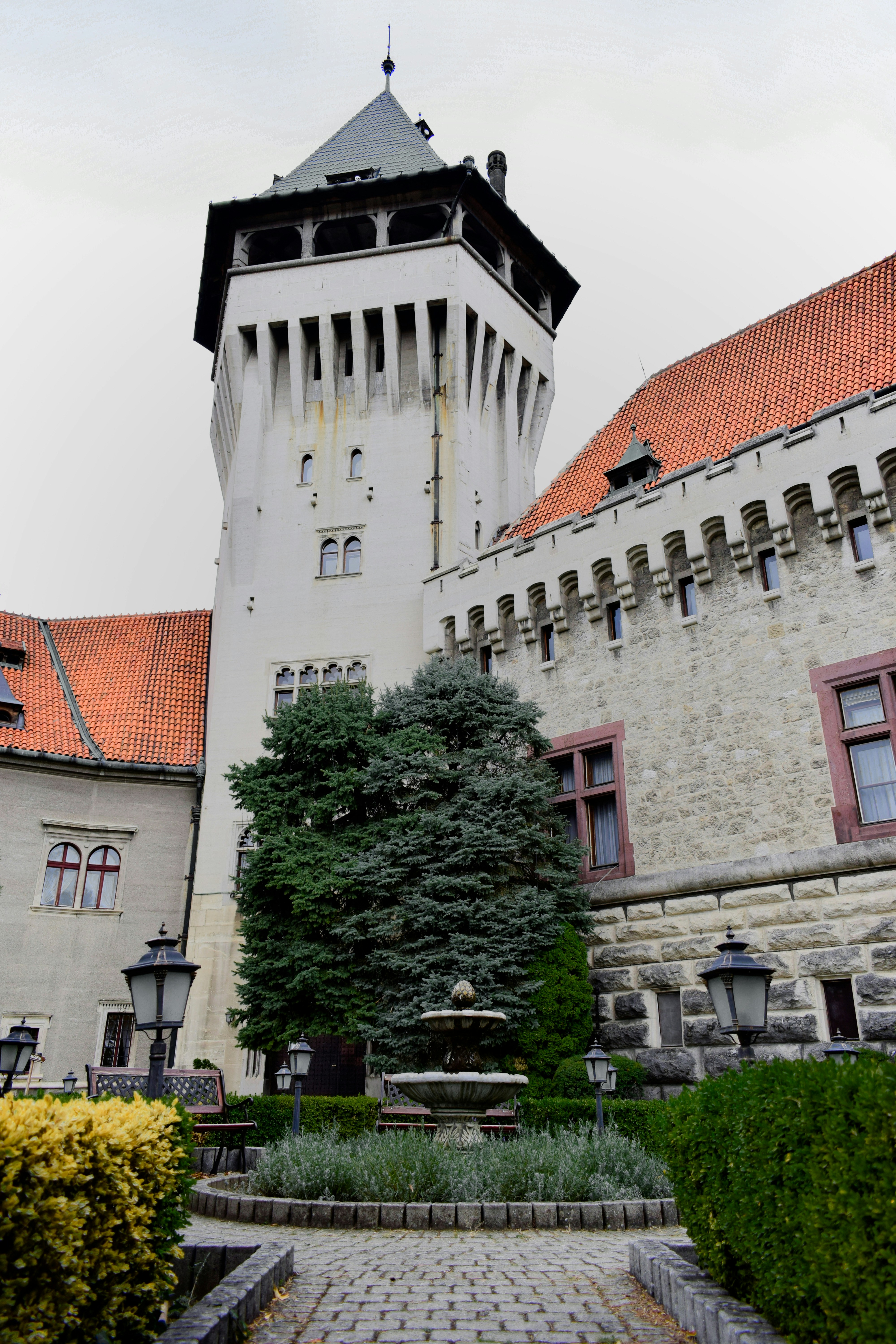 Castle Courtyard with Central Fountain and Tower