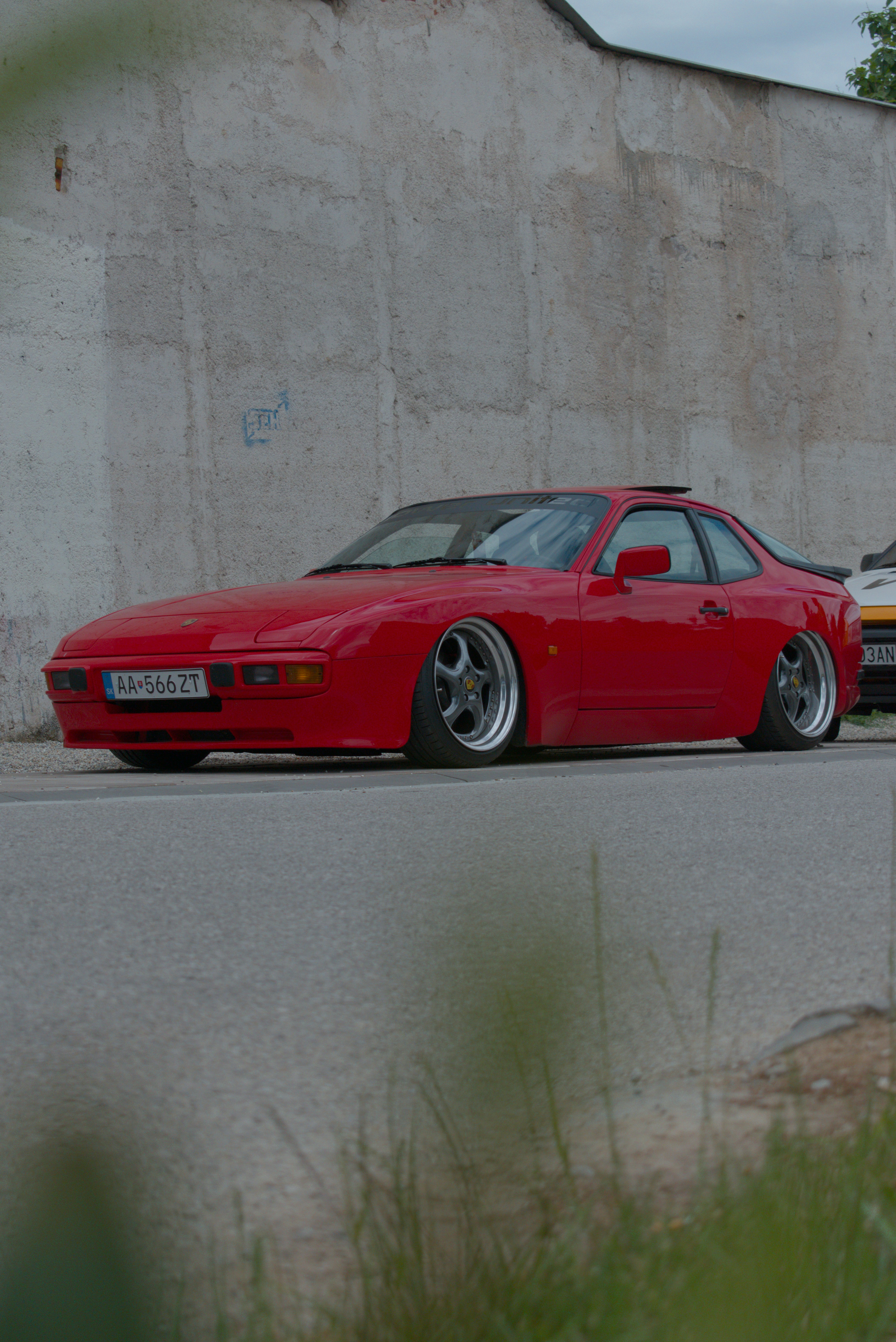 Low Angle Red Thunder: A Classic Porsche Stalks the Street