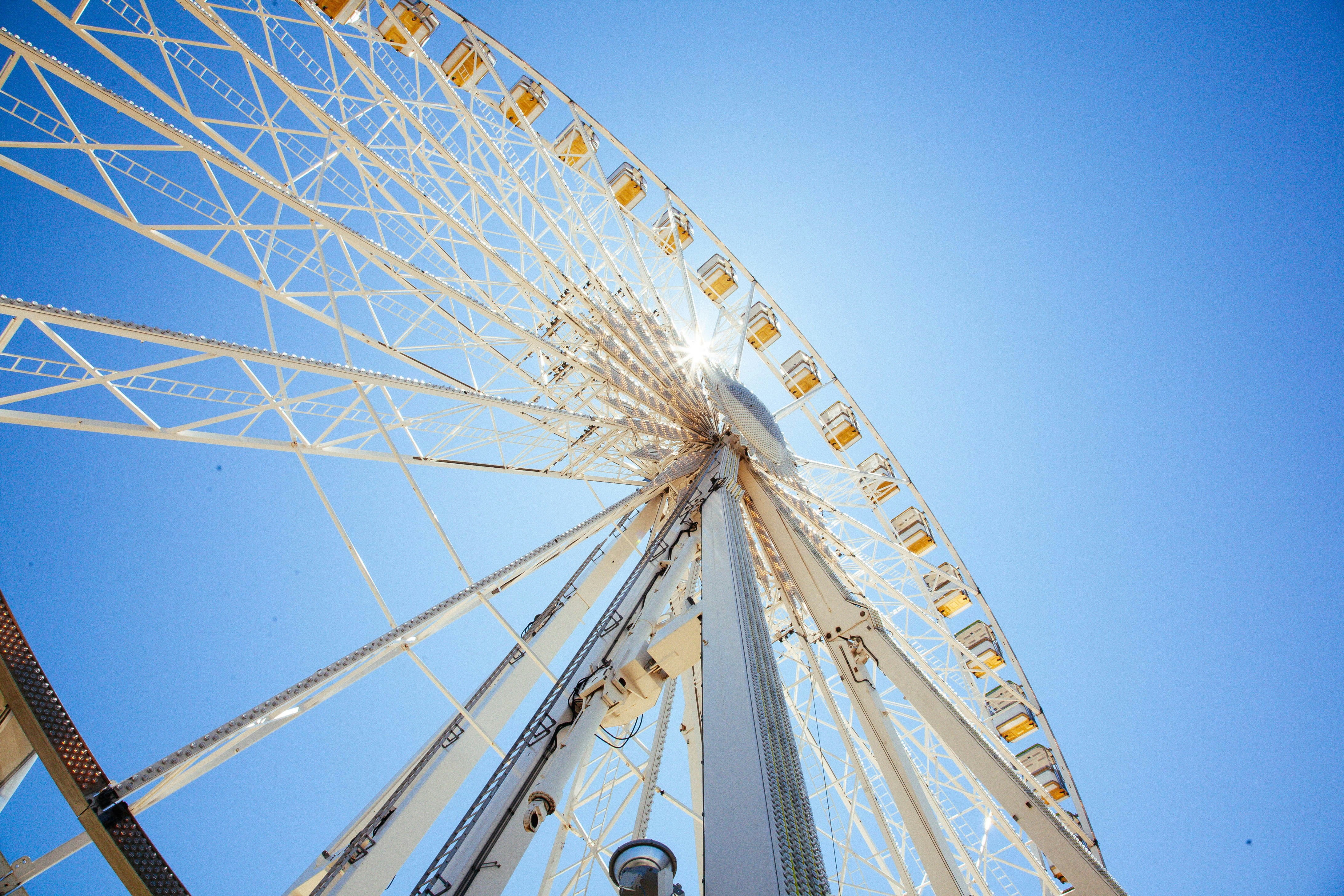Ferris Wheel Ascending into a Clear Summer Sky