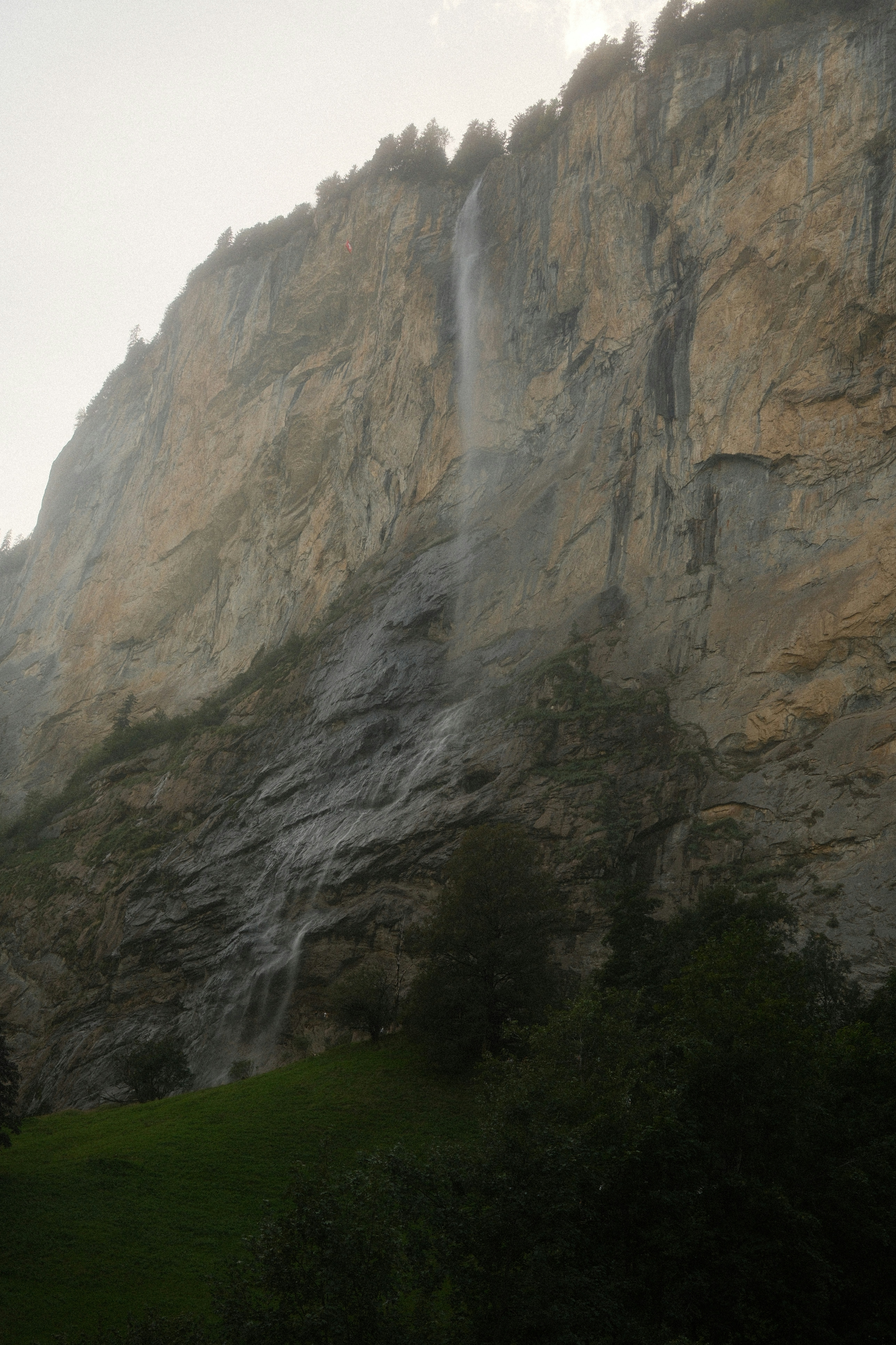 Majestic Cascade on a Rugged Cliff