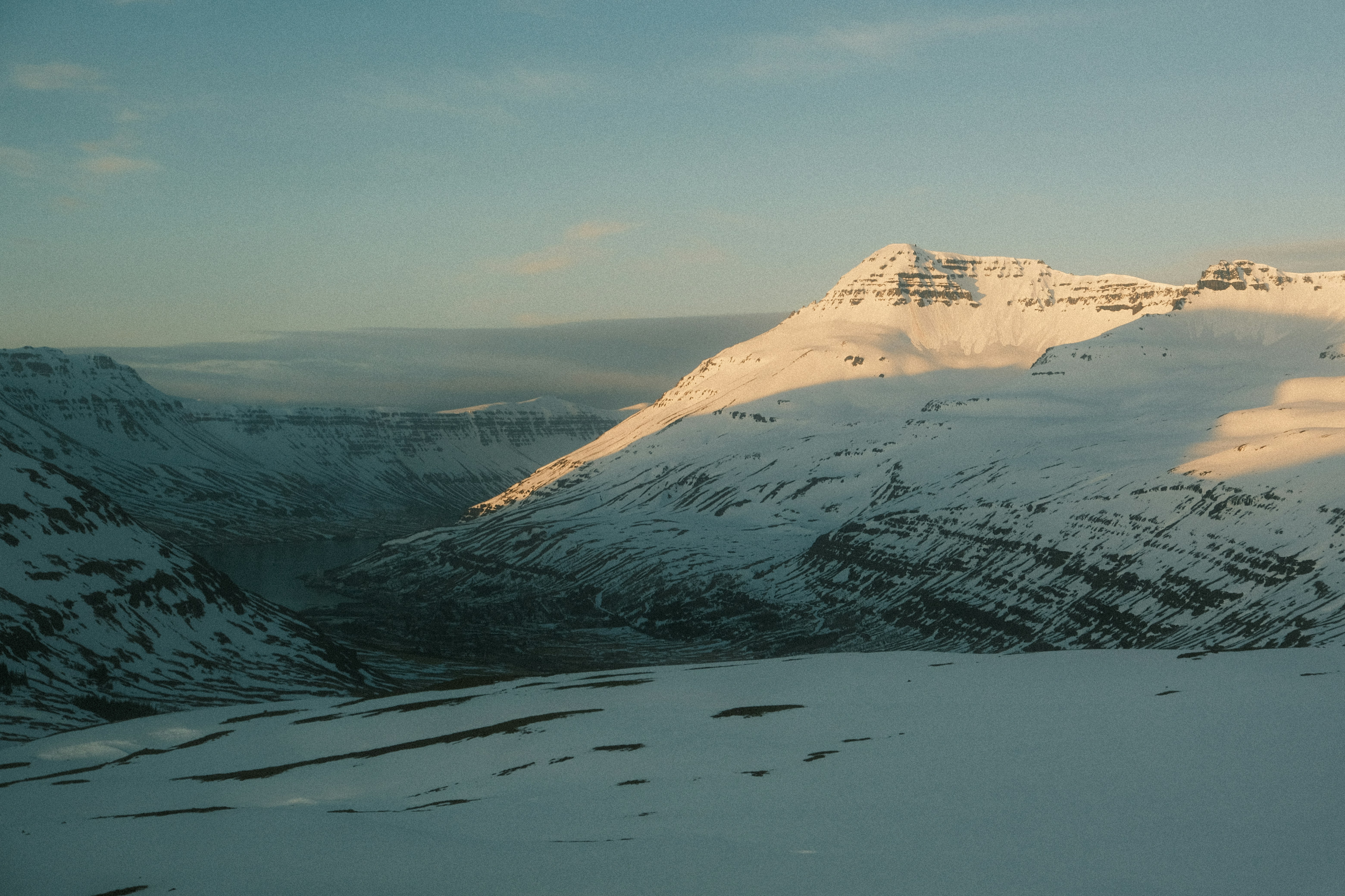 Sunlit Crest: A Quiet Winter Panorama