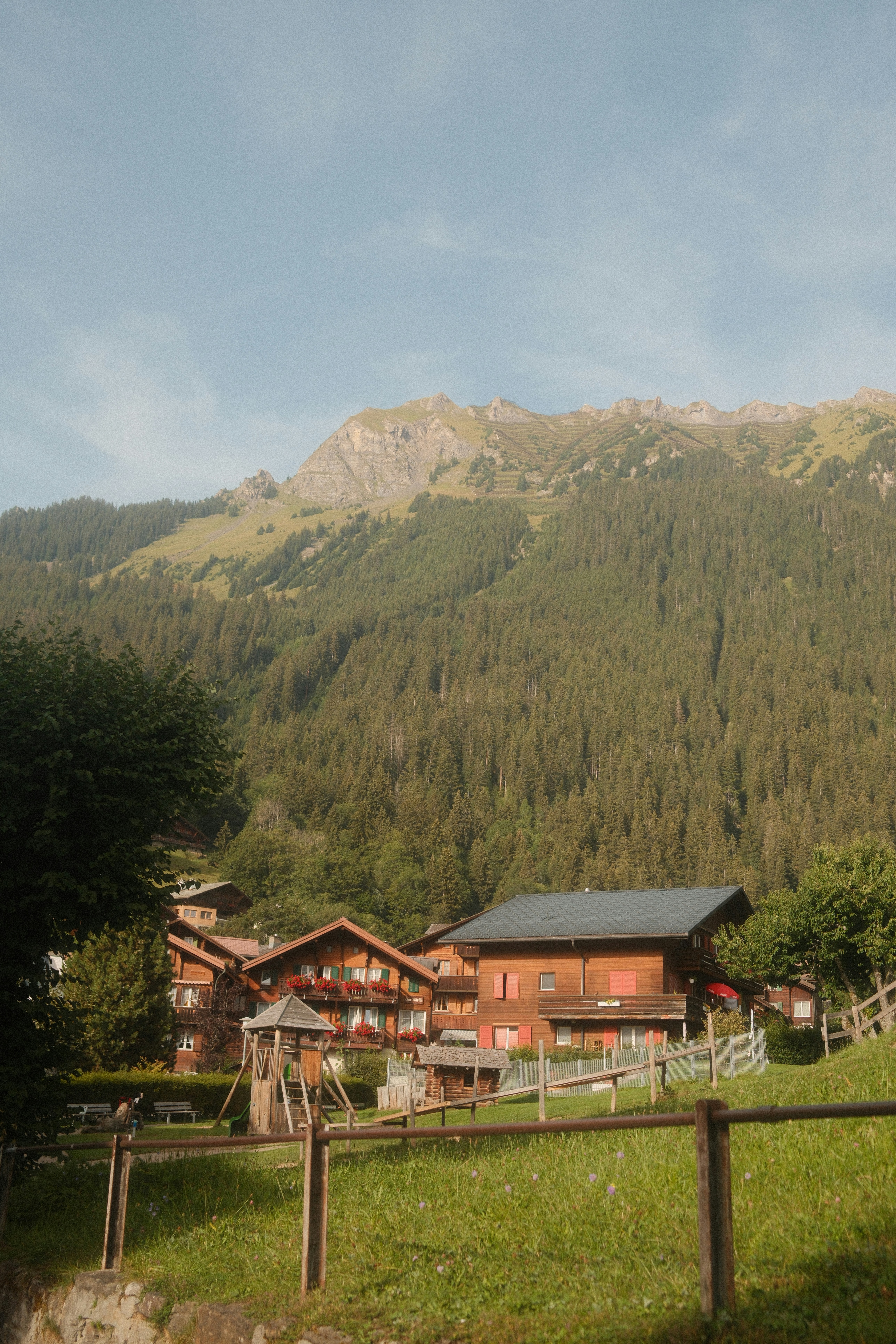 Alpine Village beneath a pine-studded cul-de-sac of peaks