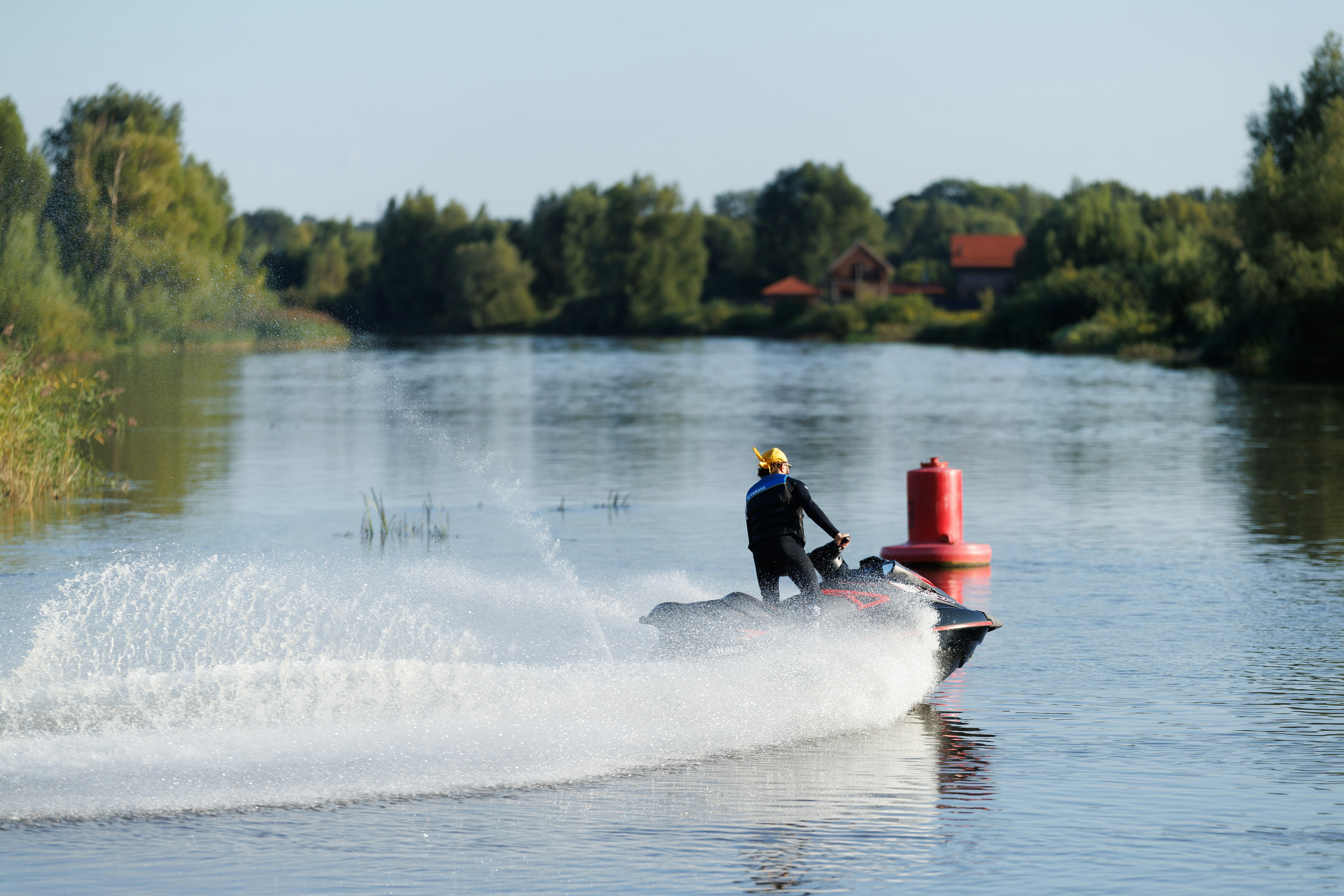 Rushing Wake: Jet-Ski Spear of Motion Across a Calm River