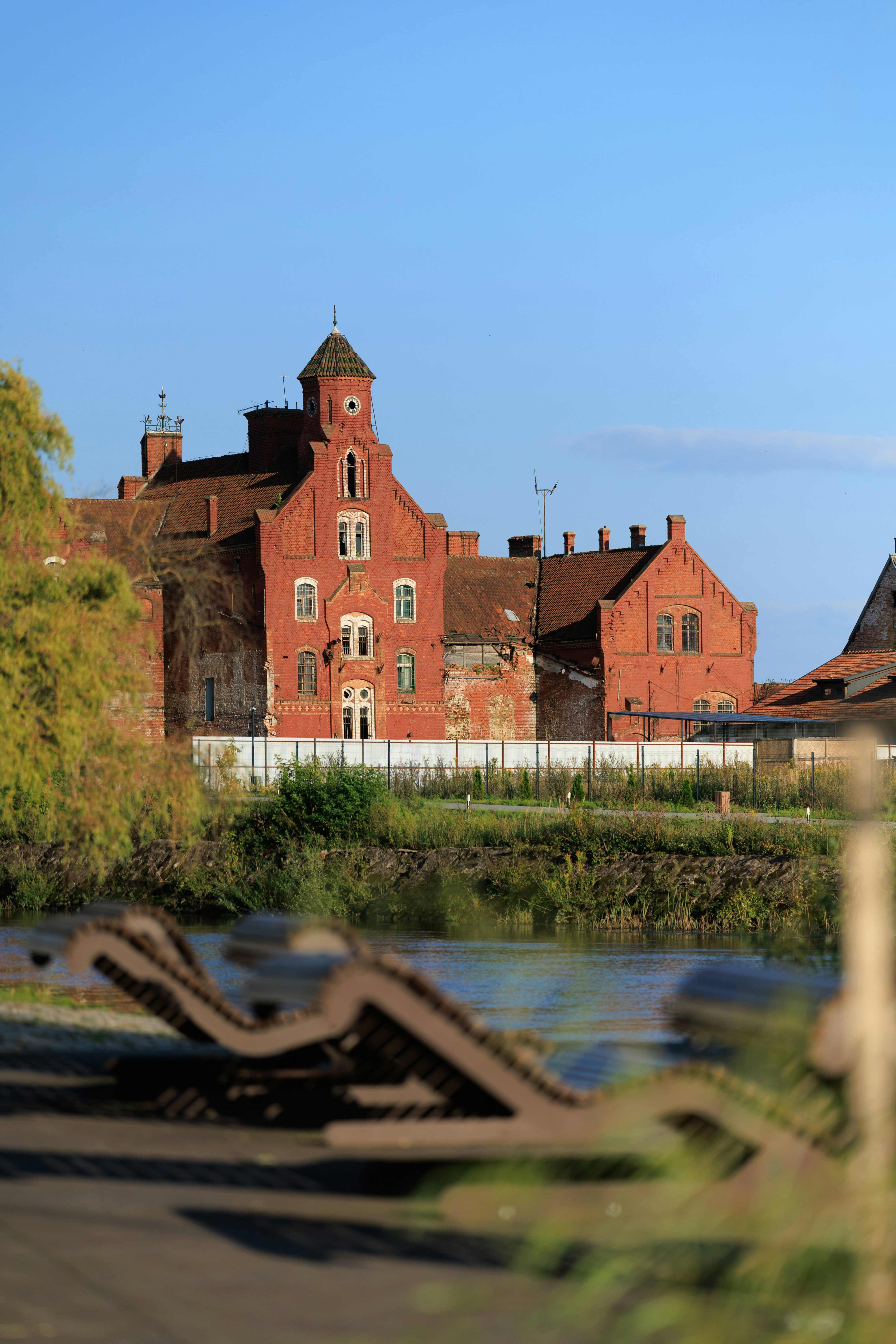 Brick Nook by the River: A Looming Factory Glow