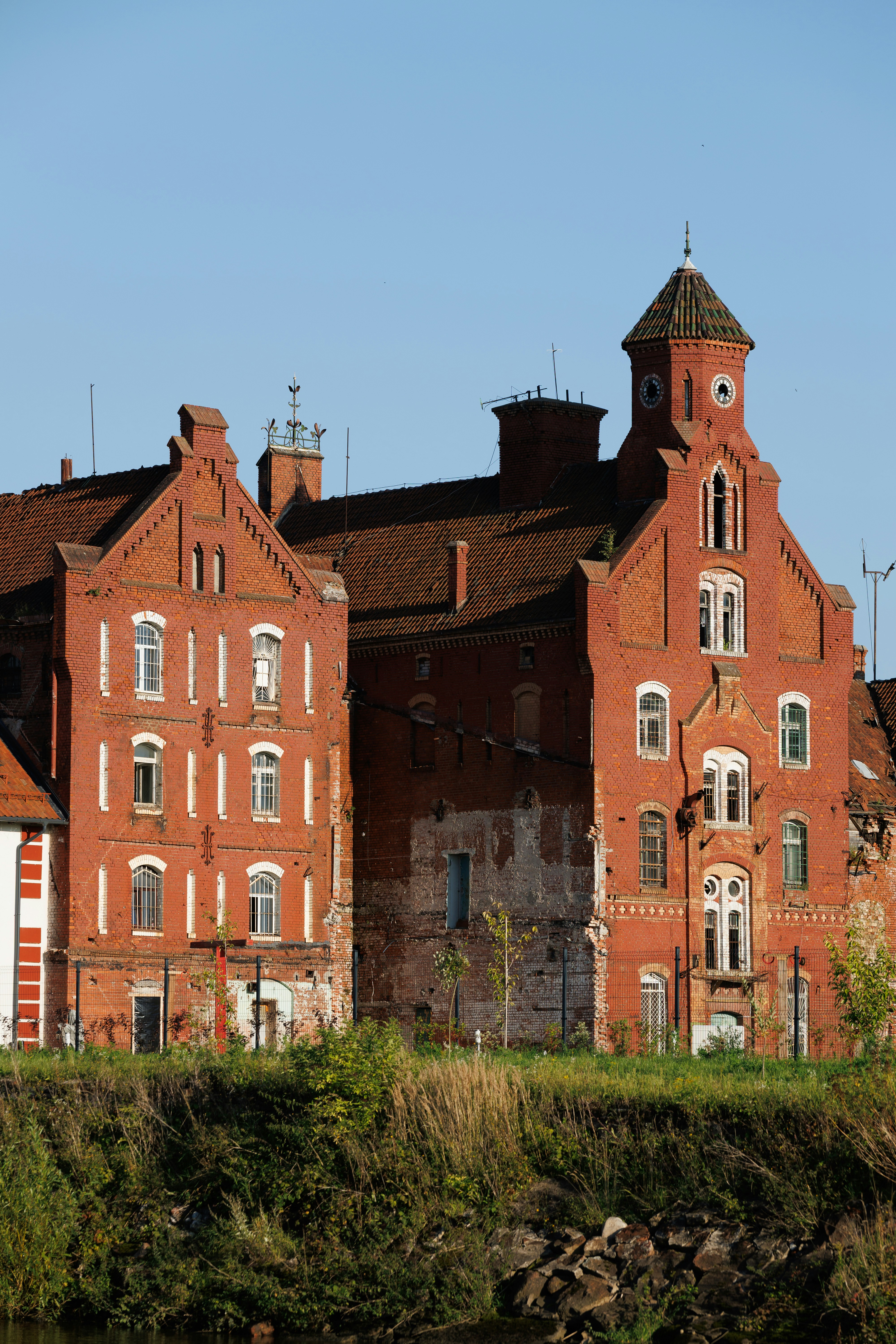 Brickwork Chronicles: A Sunlit Facade of Red Towers
