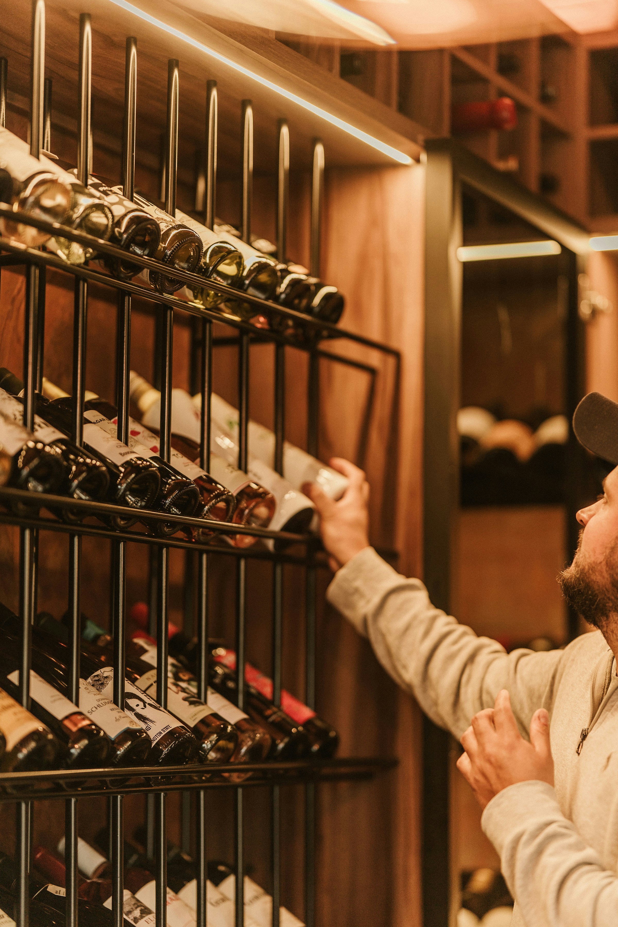 Wine Shelf Portrait: A Sommelier's Touch in a Warm Boutique Setting