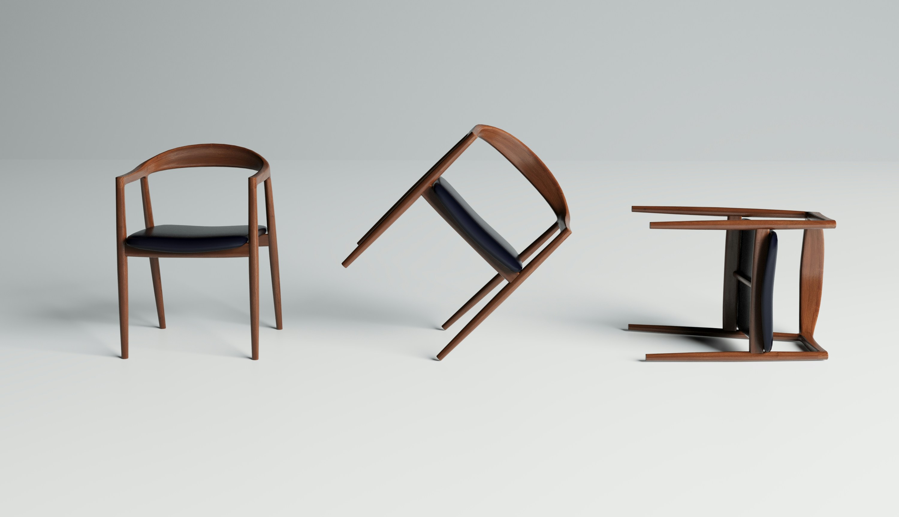Three wooden chairs with dark seats in different positions on a white background