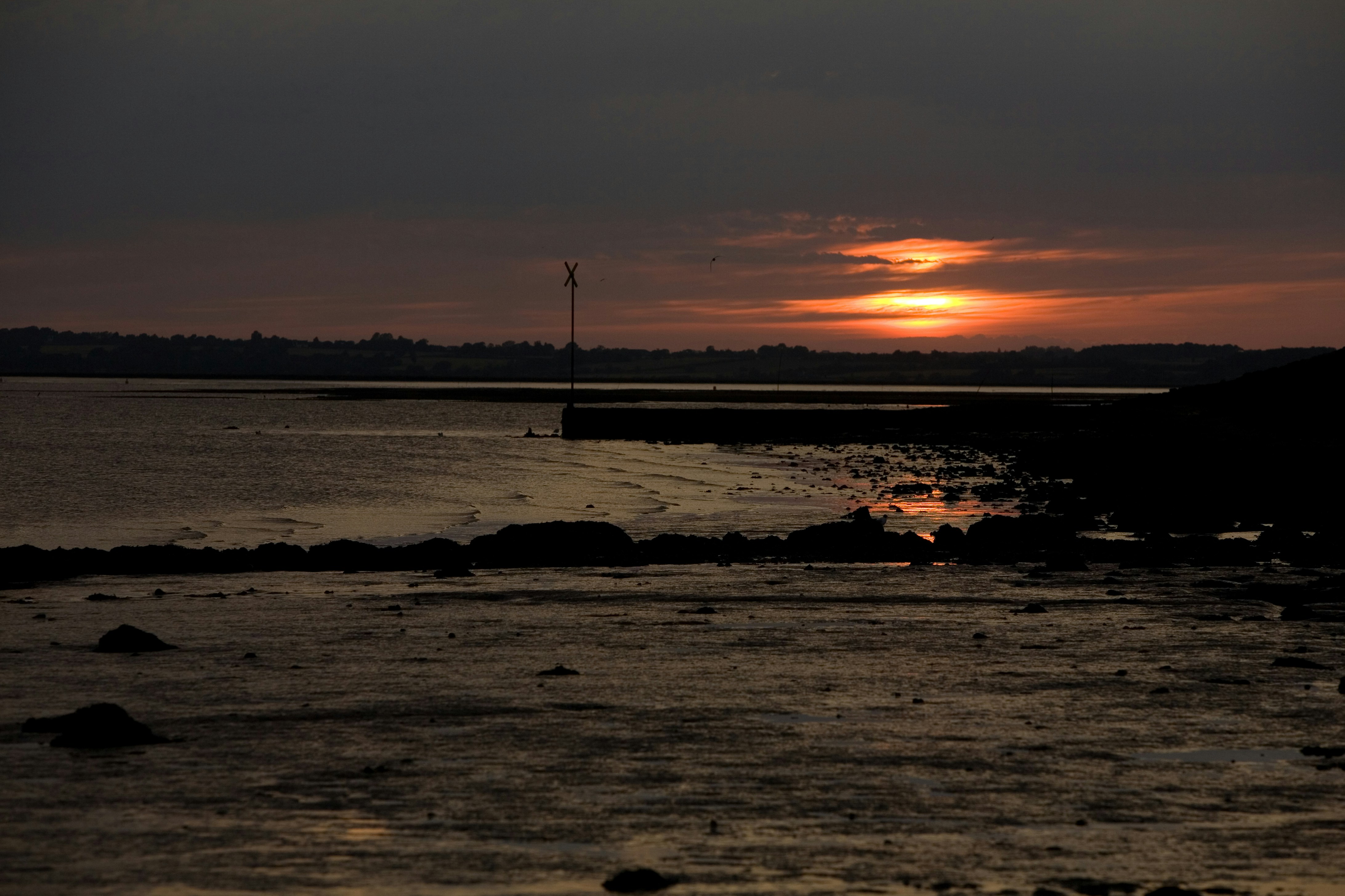 Distant Sun Over Tidal Flats