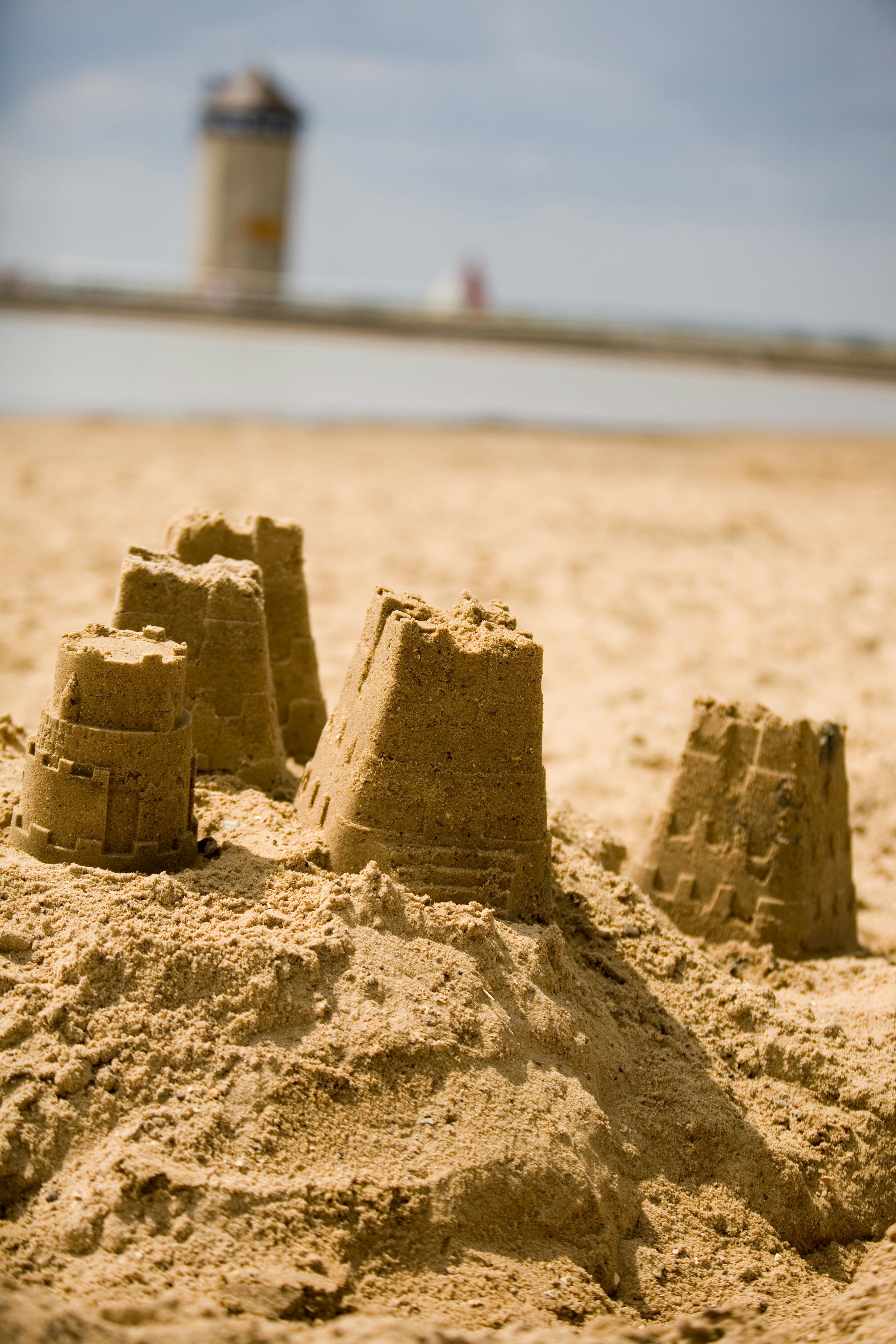 Castle of Sand: Tiny Turrets under a Coastal Sky