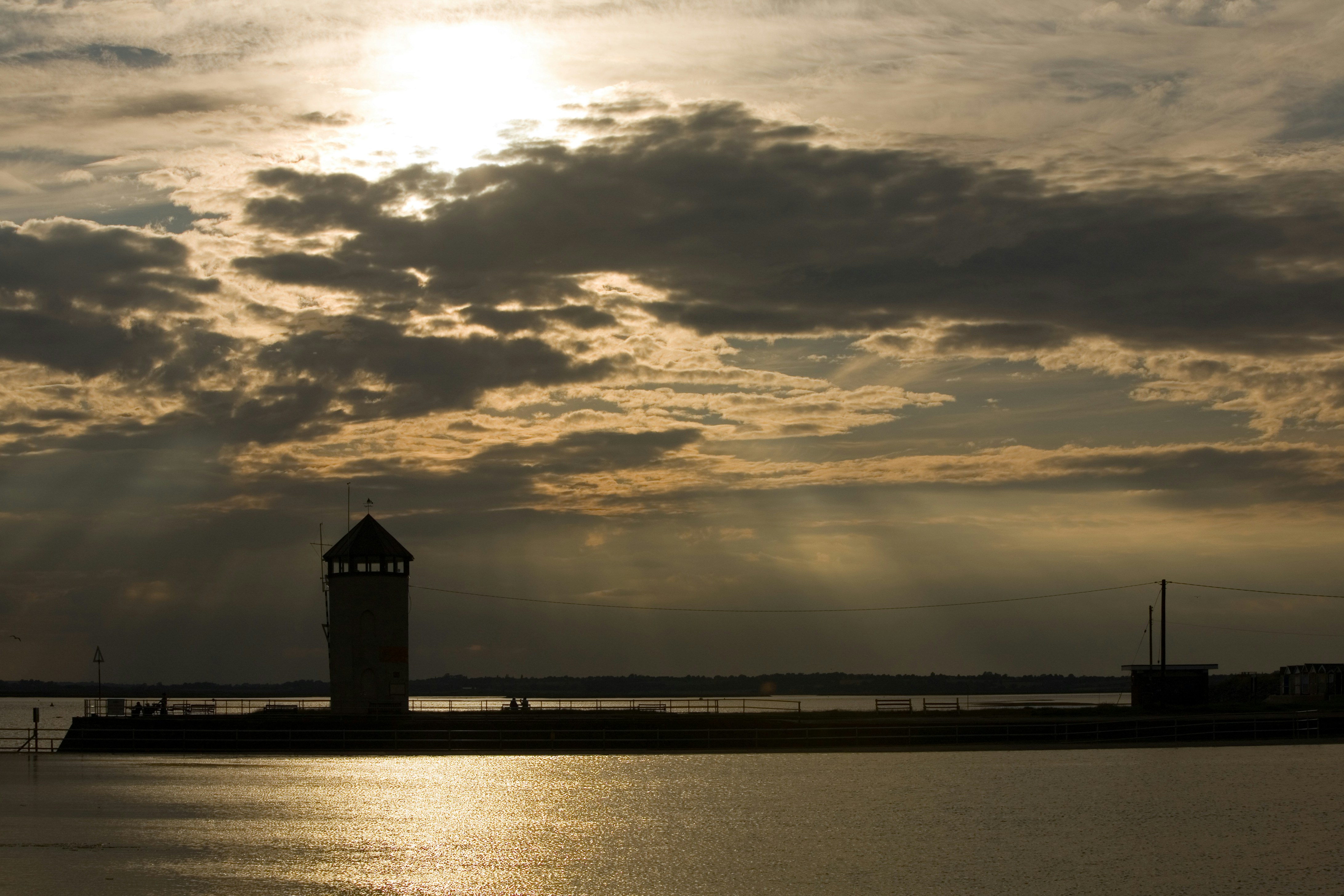 Dusk Sentinel: A Lighthouse Tower Standing Against the Golden Tide