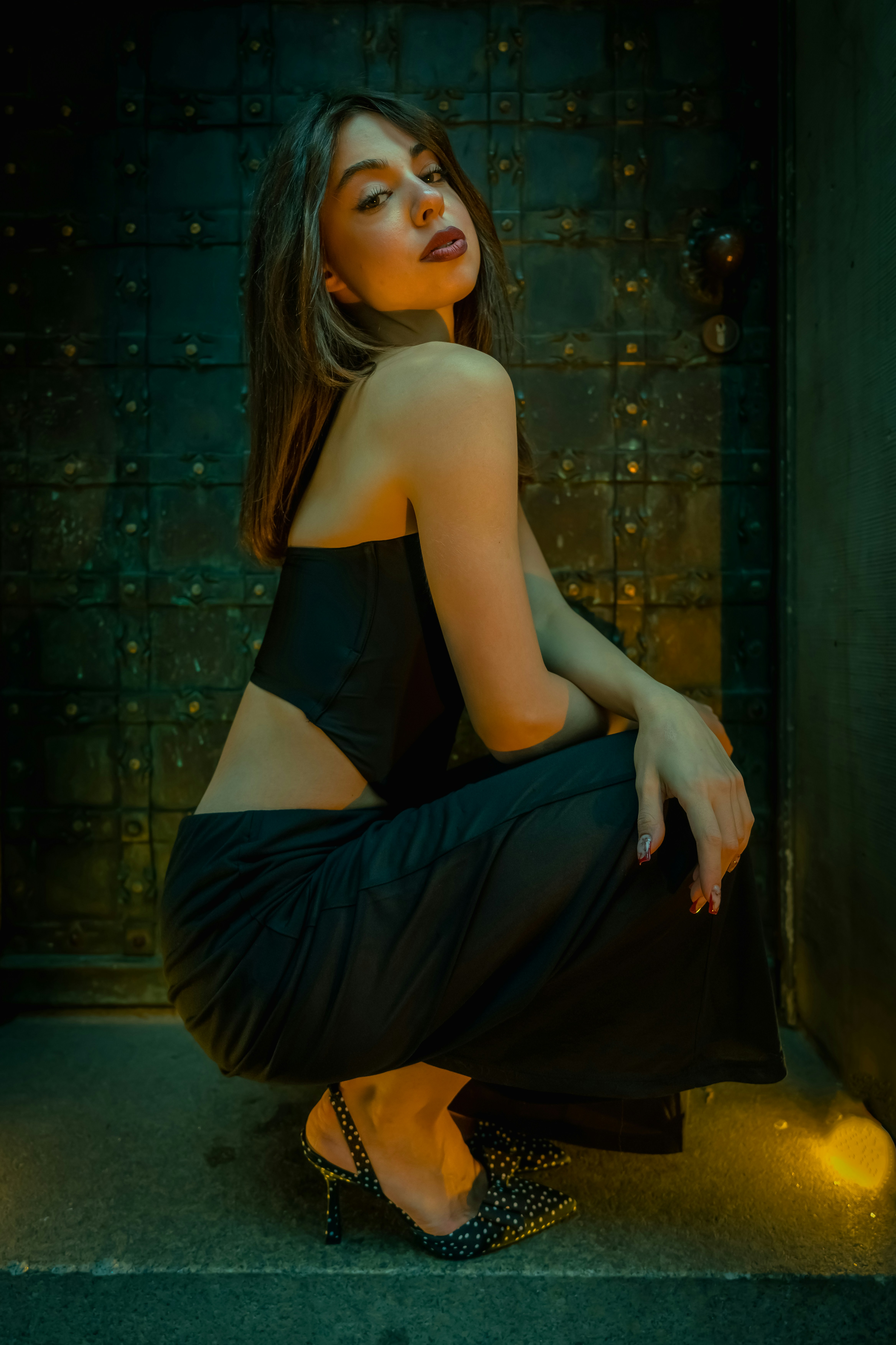 Midnight Velvet: A Poised Moment on Steel Steps
