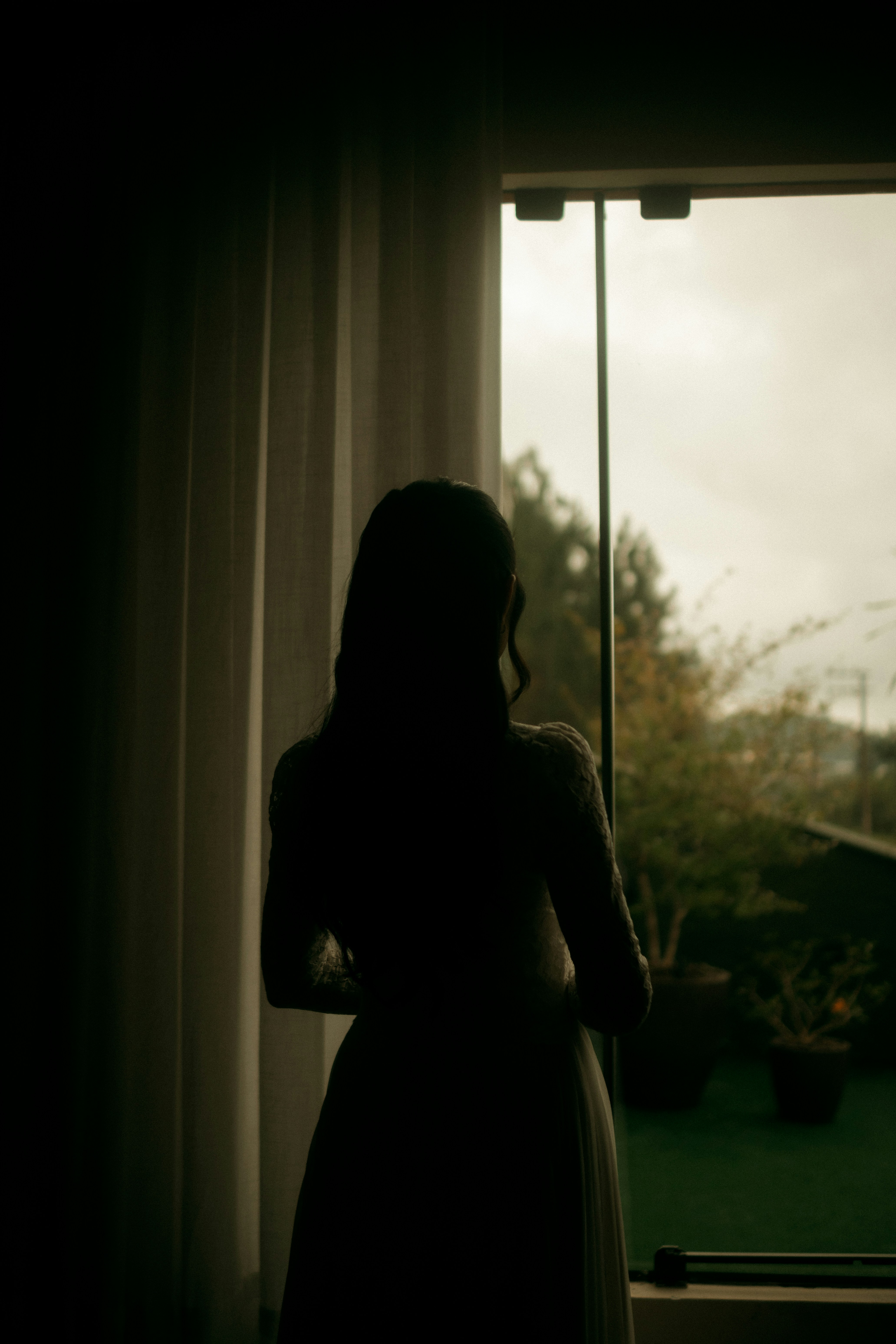 Silhouette by the Window: Quiet Hallway to Morning Light