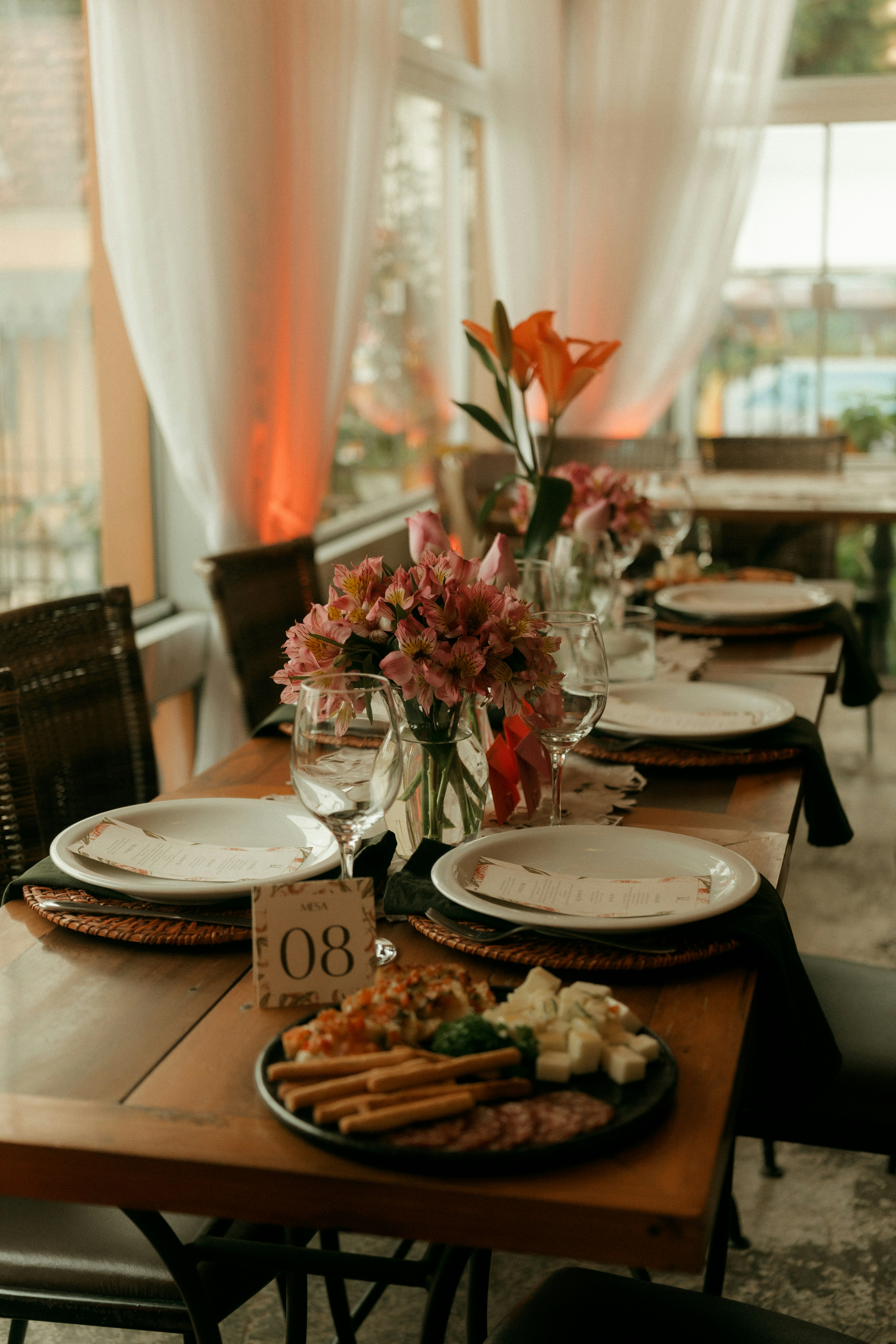 Tabletop Feast: A Floral Tableau Framing a Gourmet Platter