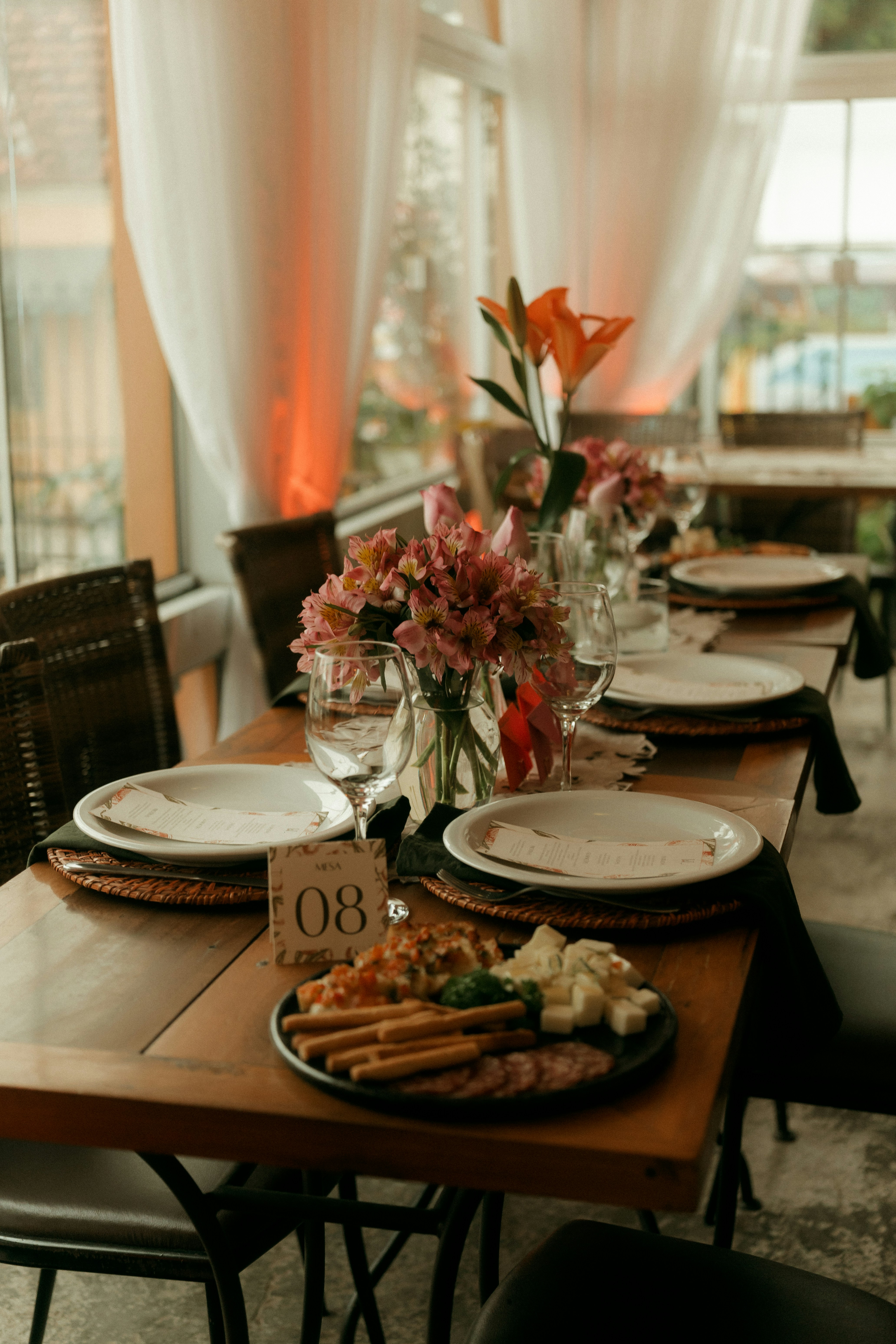Table Setting in Soft Amber Light with Floral Centerpiece