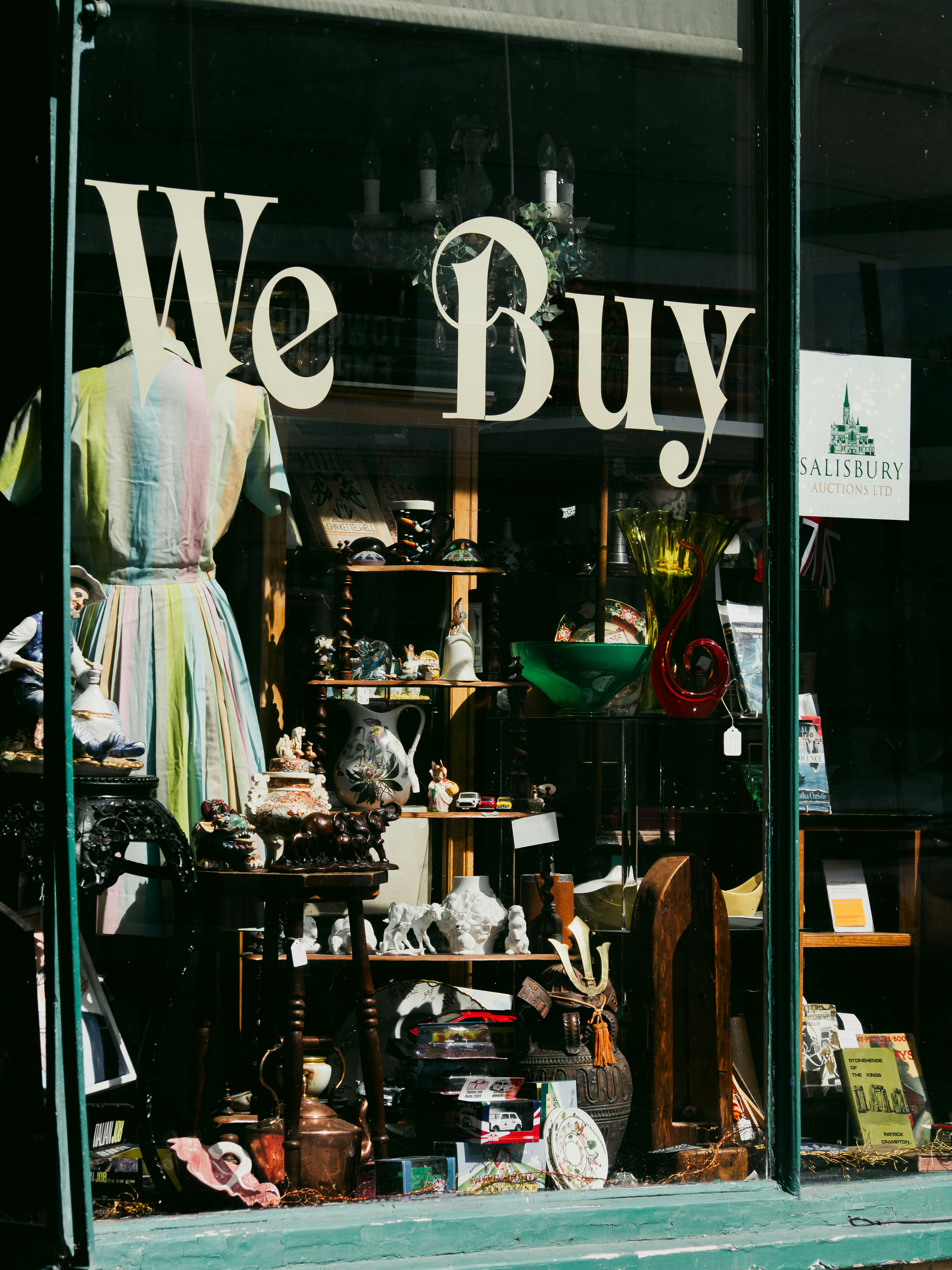 The Glass-Front Treasure: Vintage Trinkets in a Candy-Hued Window