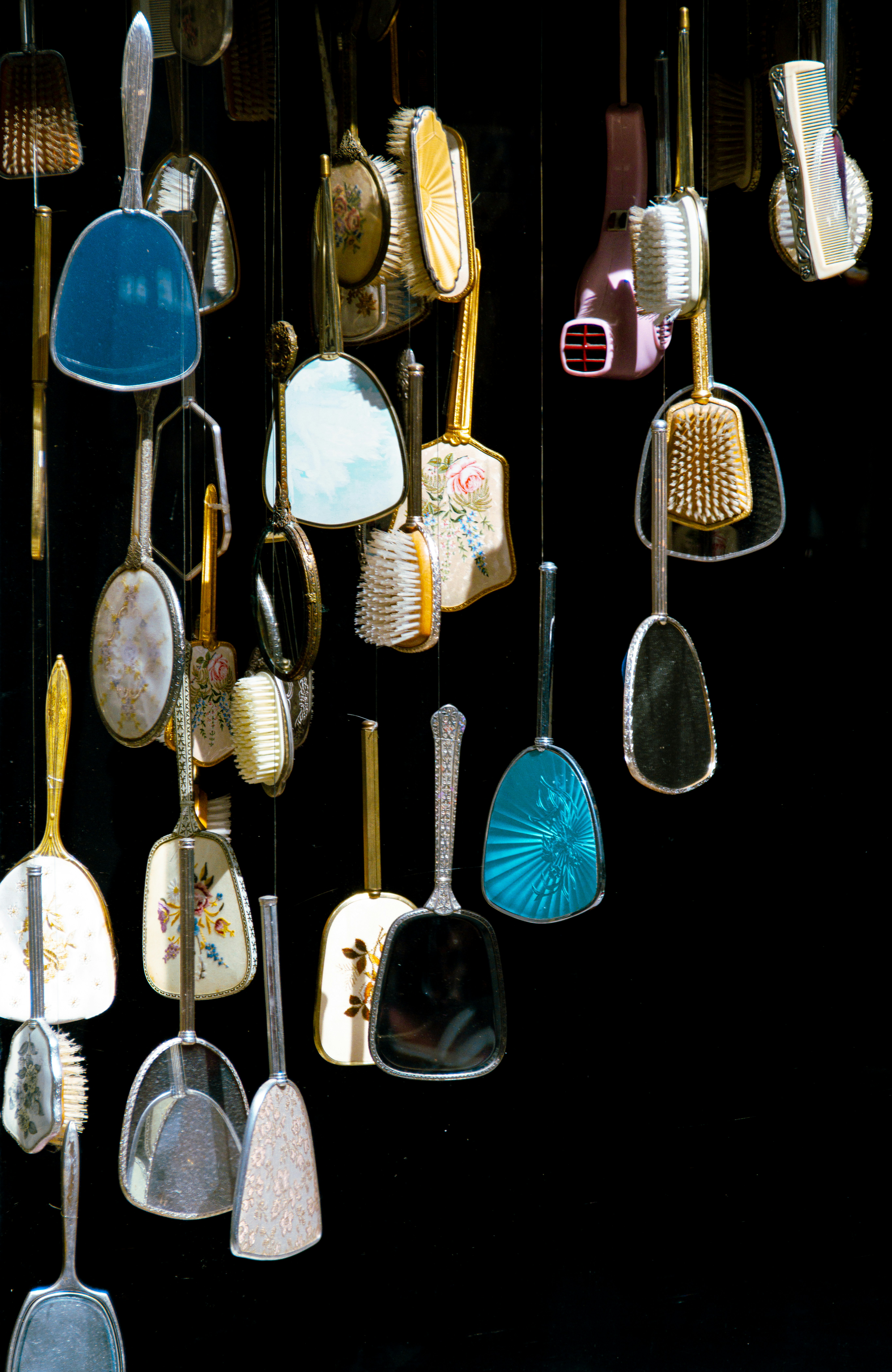 Chimes of Color: Hanging Grooming Tools in a Playful Display