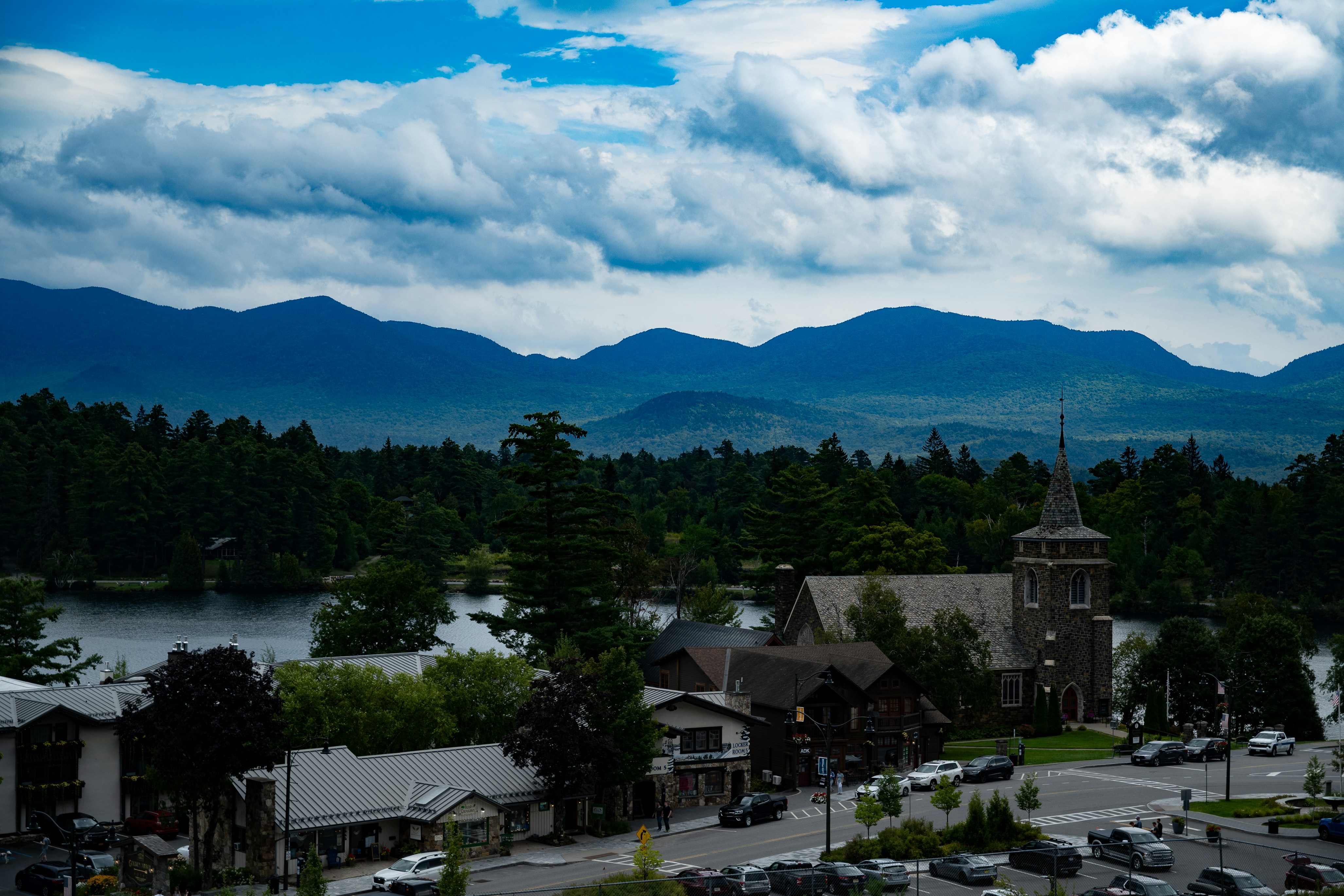 Mountain-town Clocktower Beneath a Layered Sky