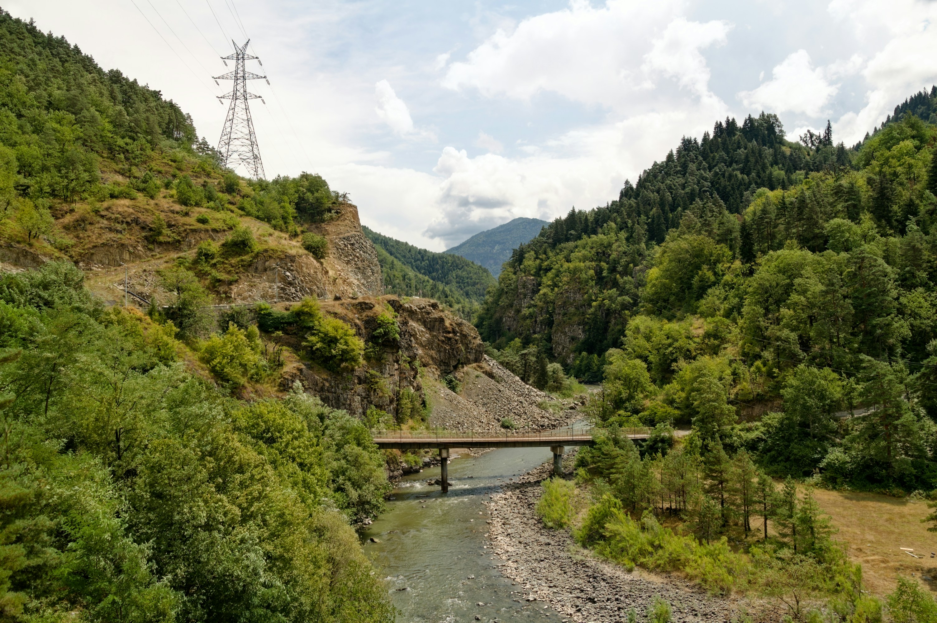 Bridge over a River Corridor in a Mountain Valley
