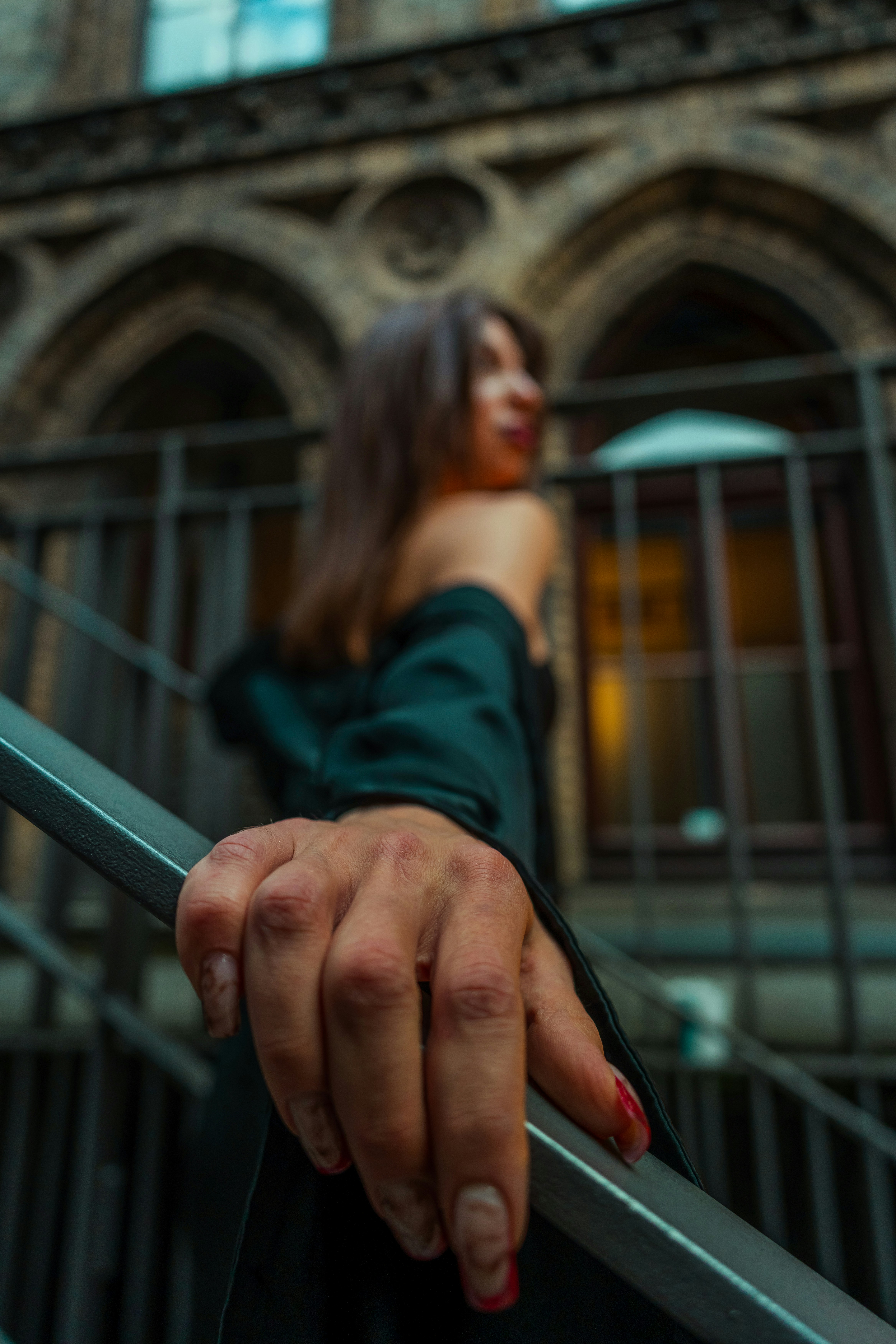 Hands on the Rail: A Moment of Connection at the Street Stairway