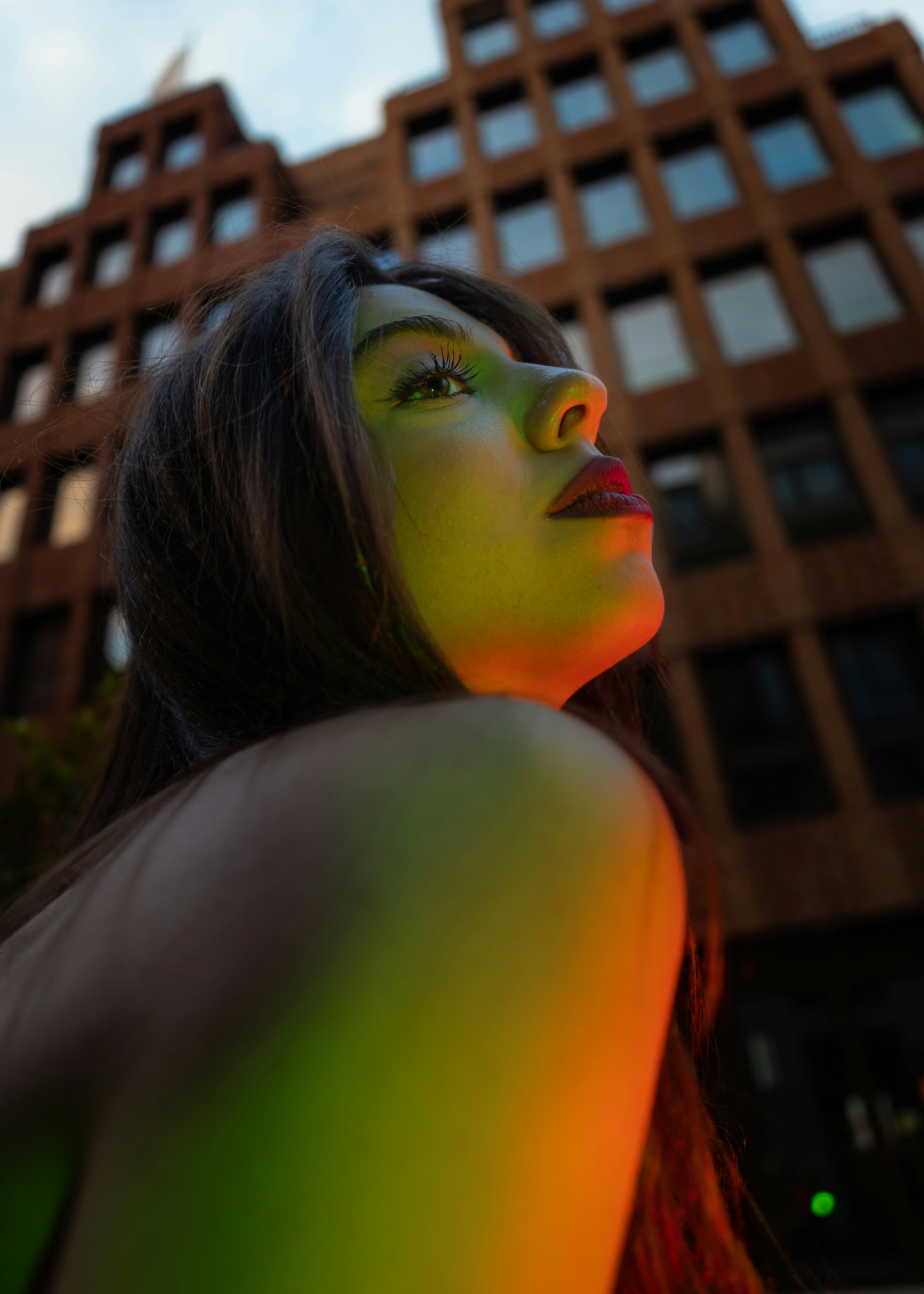 Emerald Glow on a City Face
