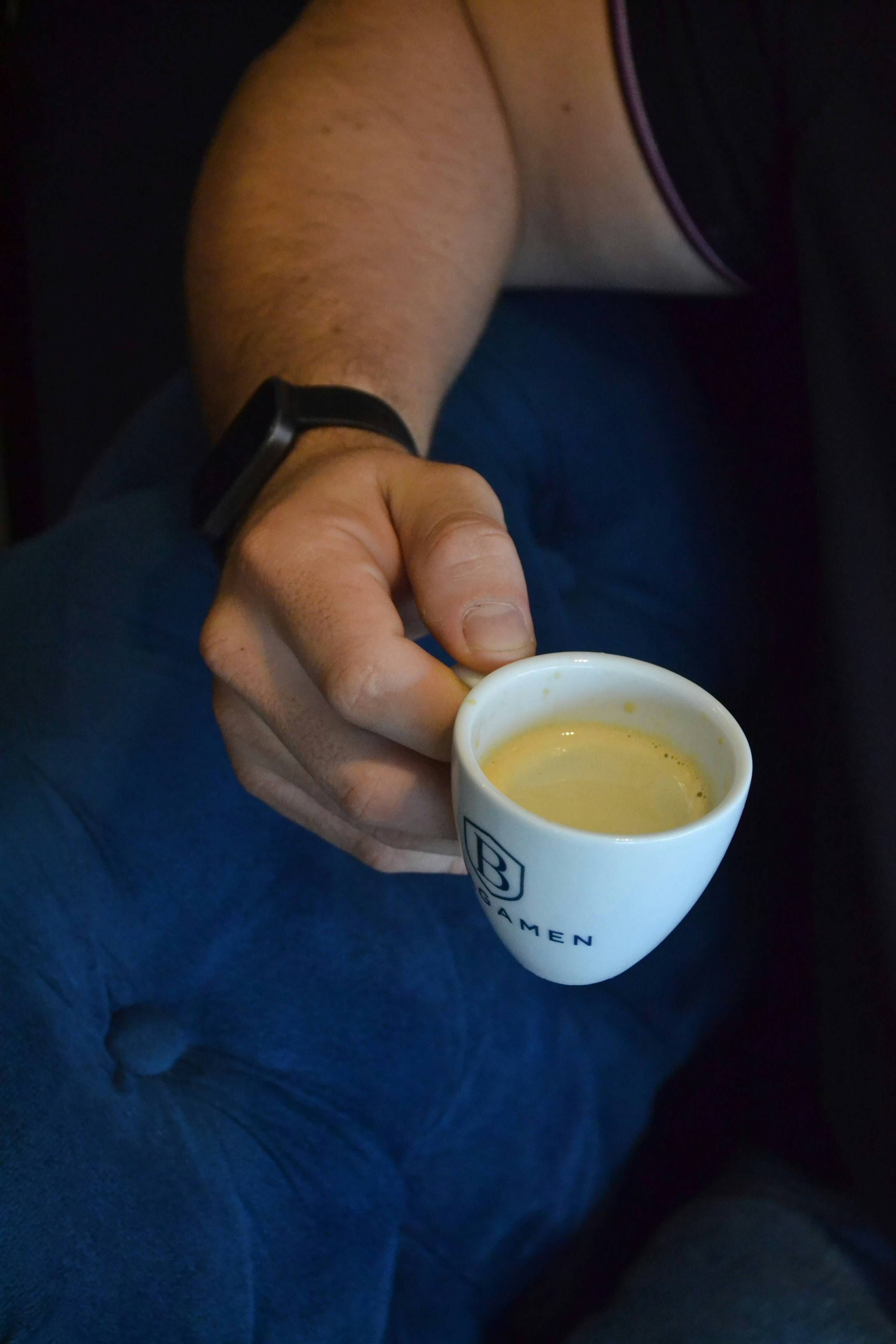 Cup of Dawn: a hand reaching in with a steaming espresso