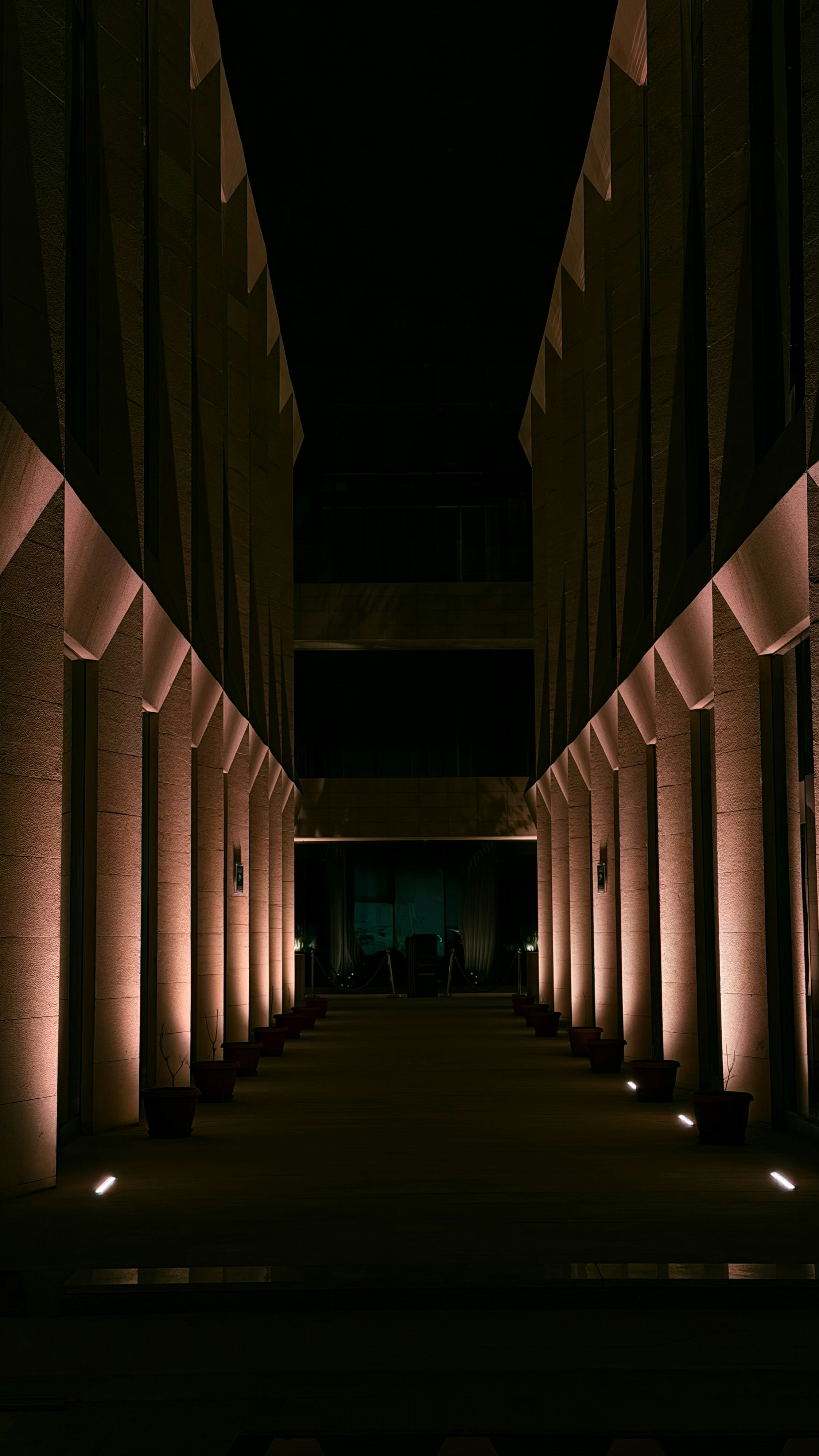 Hall of Quiet Echoes: Illuminated Columns Converge toward a Distant Doorway