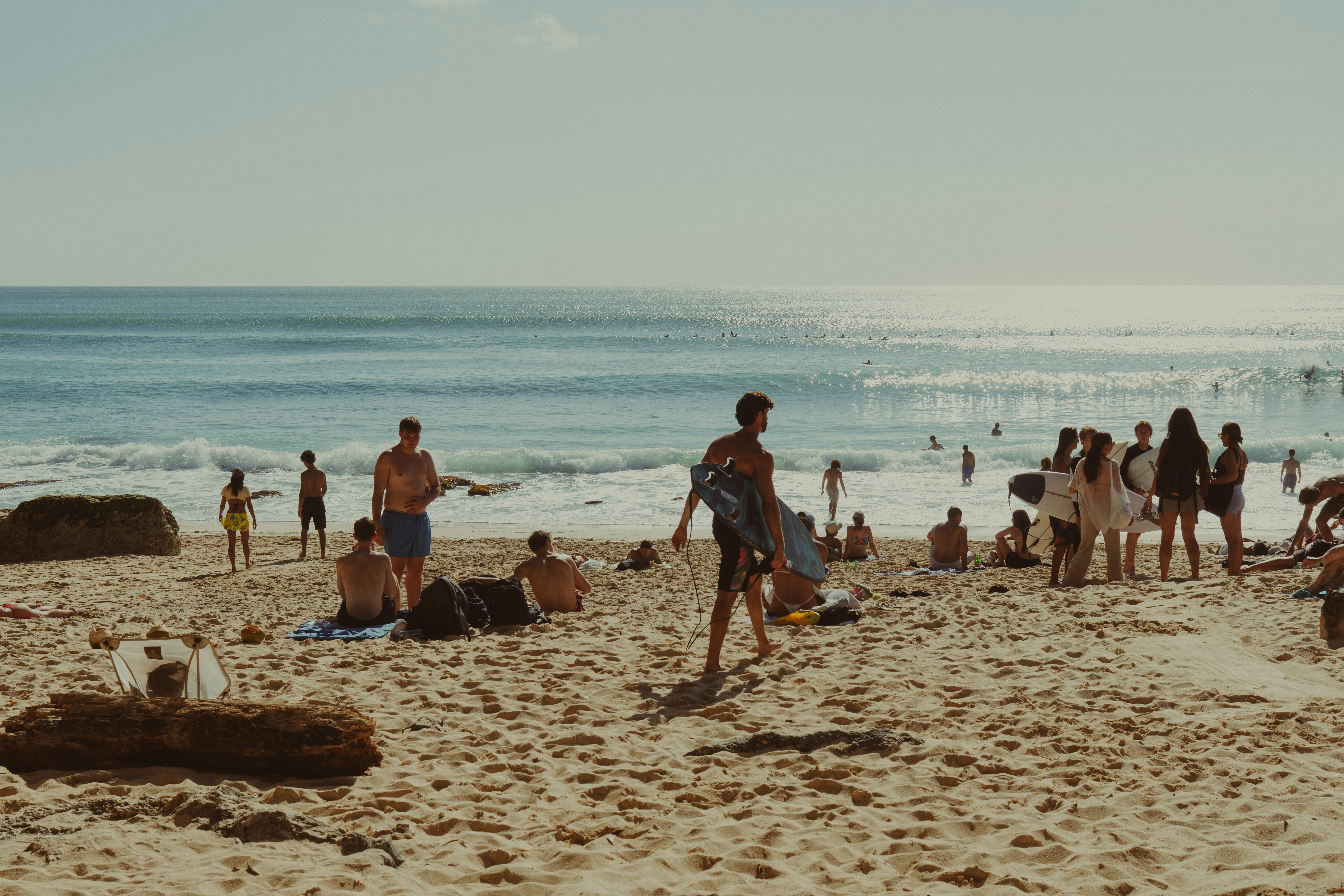 Sunlit Shallows: A Busy Beach Scene