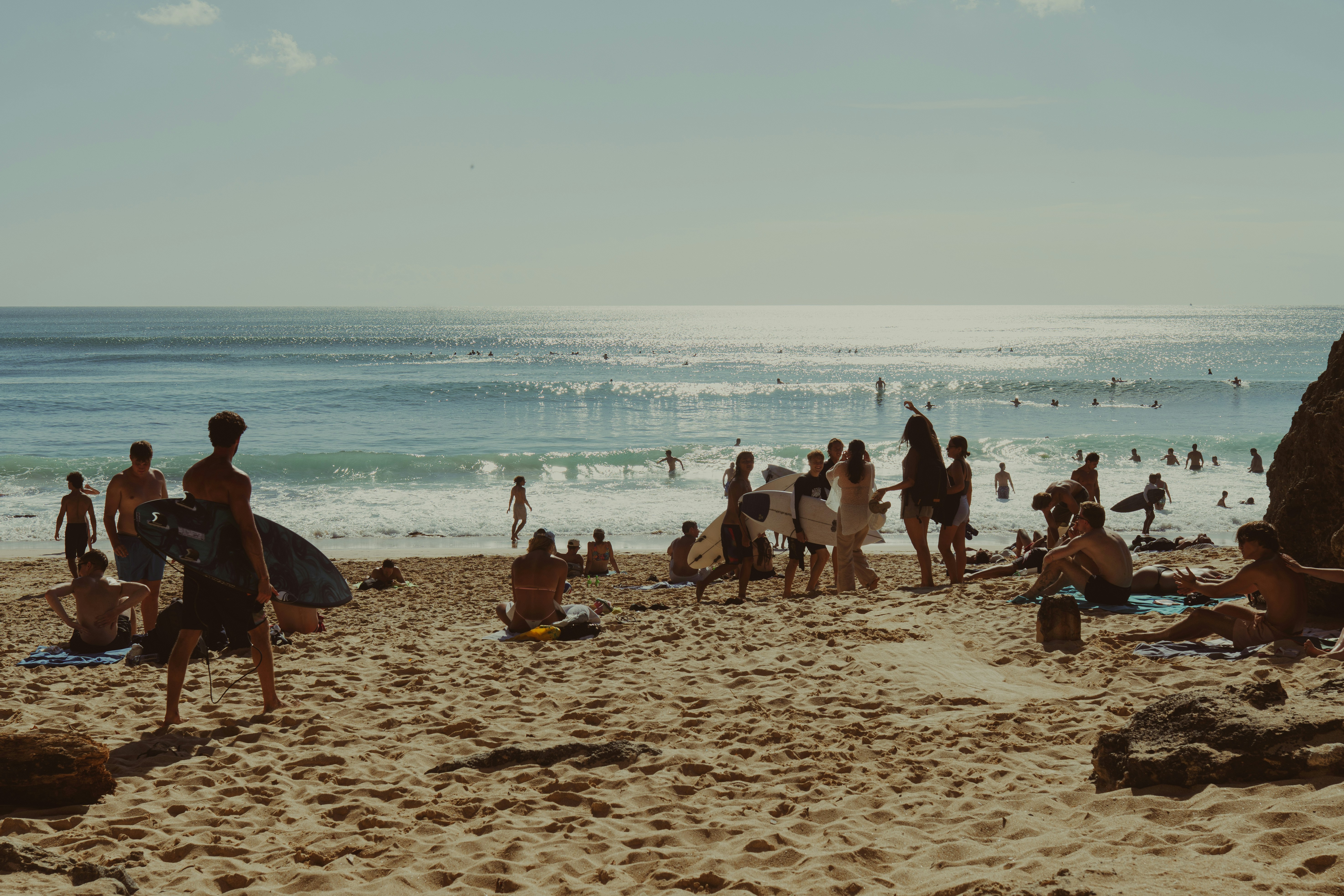 Sunlit Pulse: Families and Surfers on a Busy Coastal Stretch