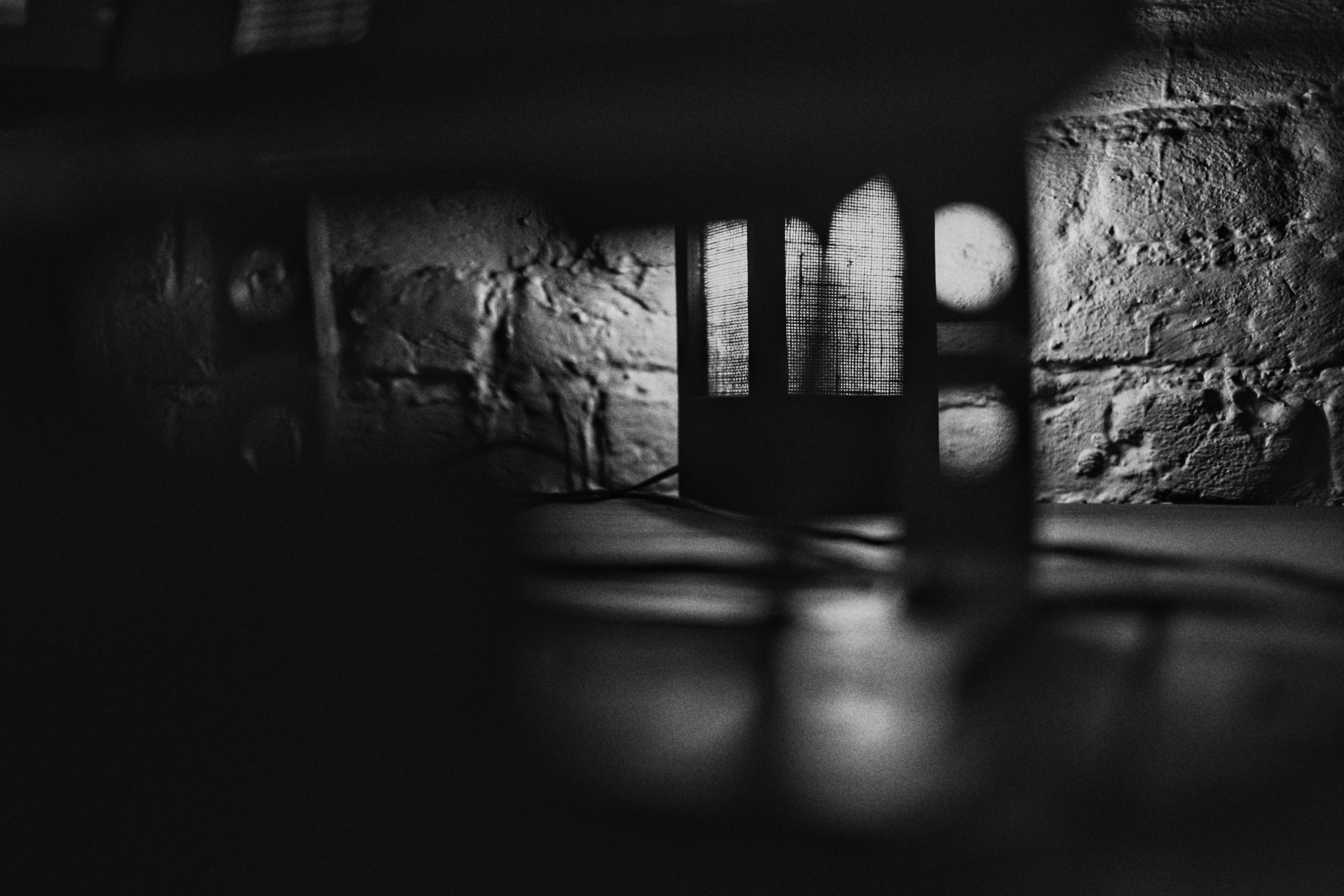 Shadows Behind the Bars: A Quiet Play of Light and Brick