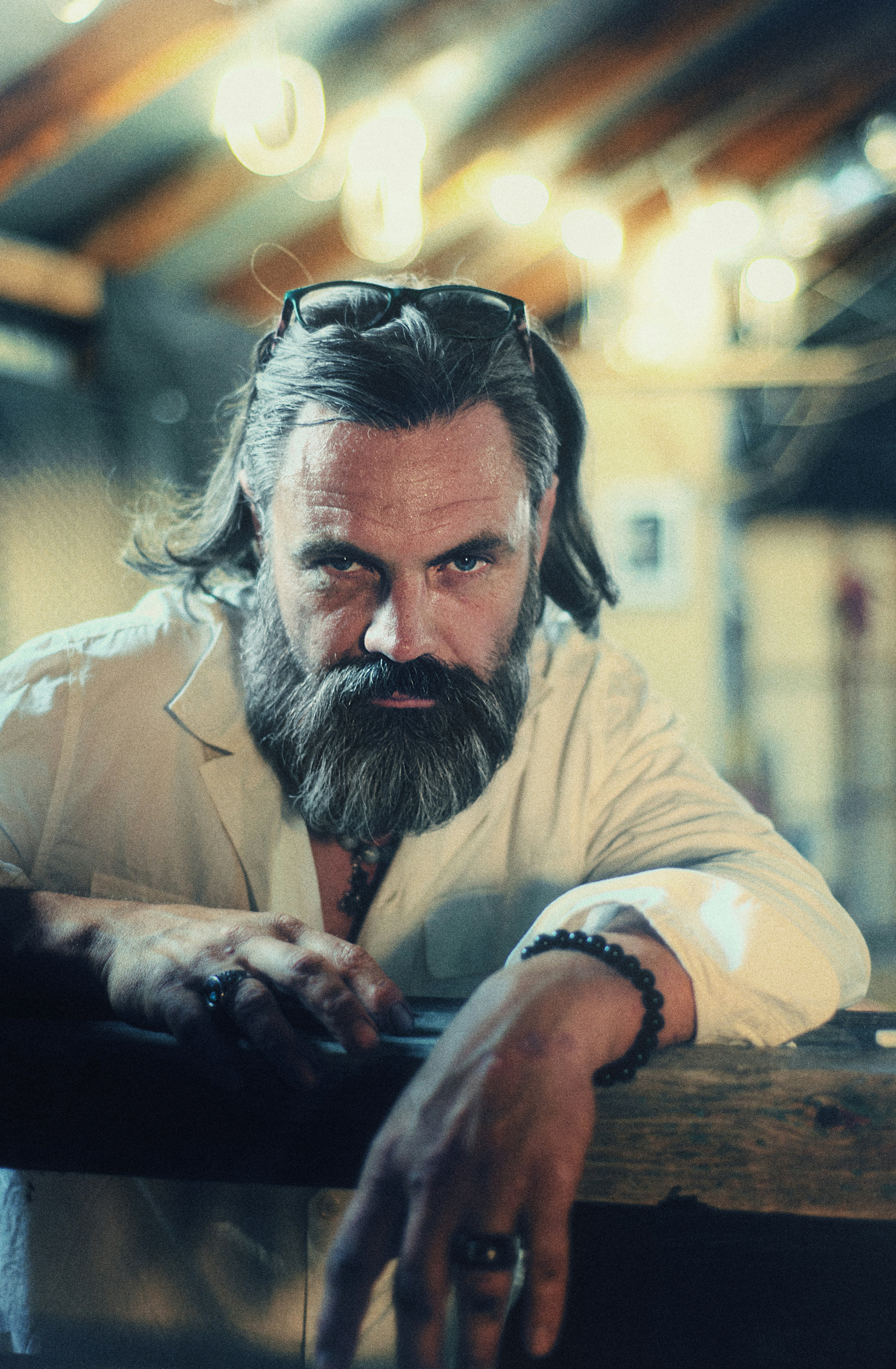 Beard and Bokeh: A Barroom Moment with Quiet Intensity