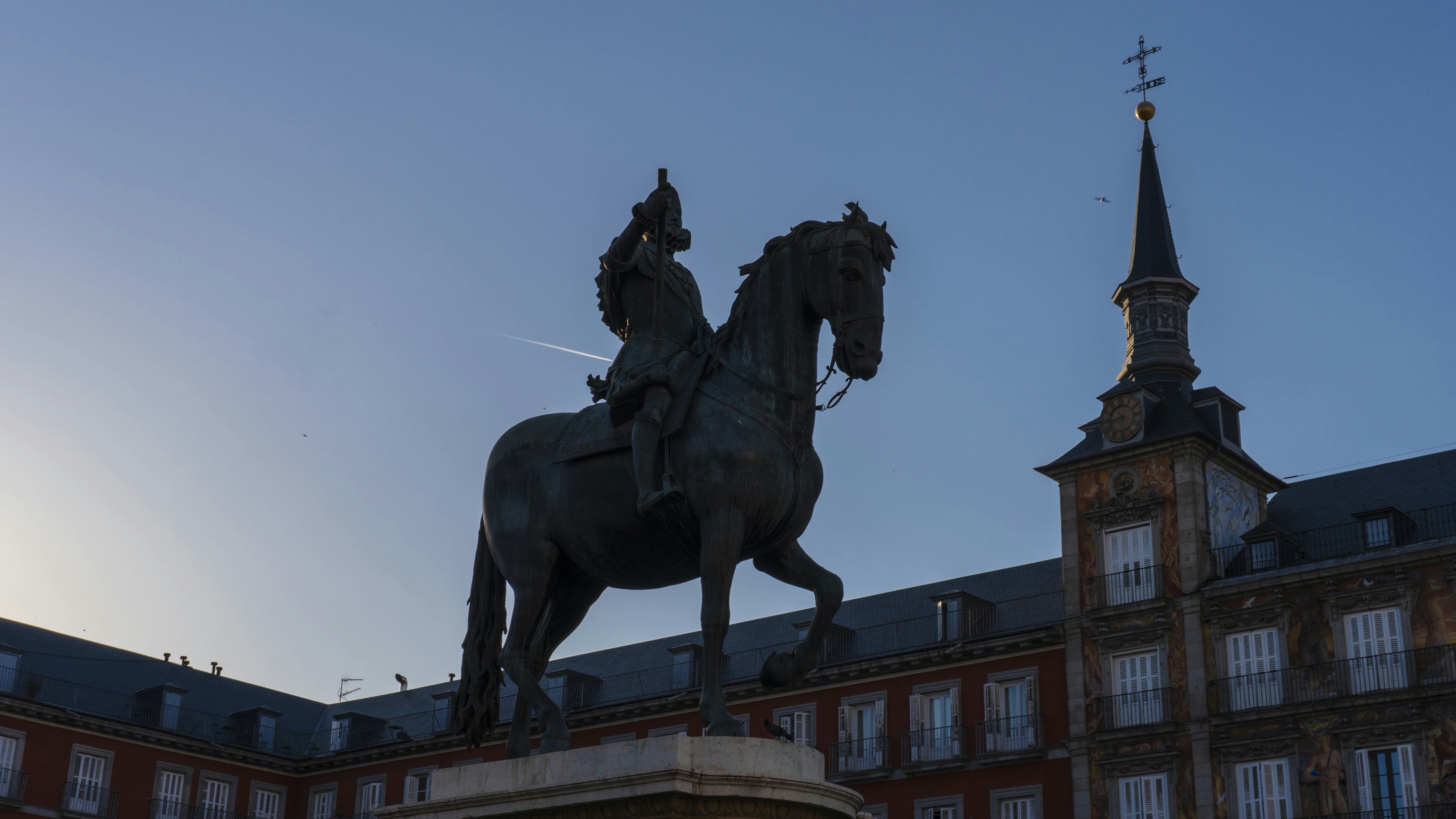 Eternal Messenger: The Horseman Silhouette Against a Historic Clocktower