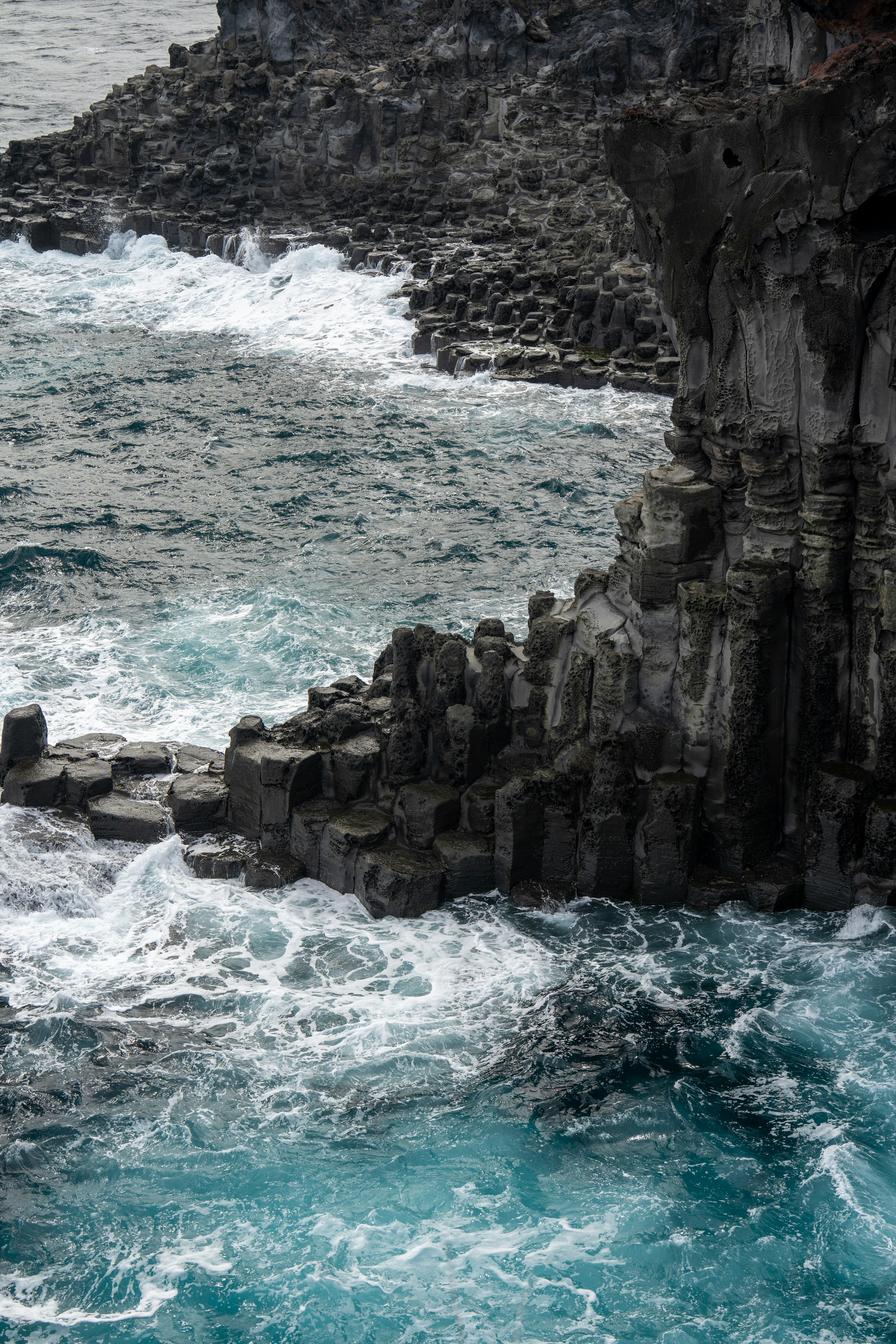 Basalt Columns Stand Guard Over Turquoise Tide