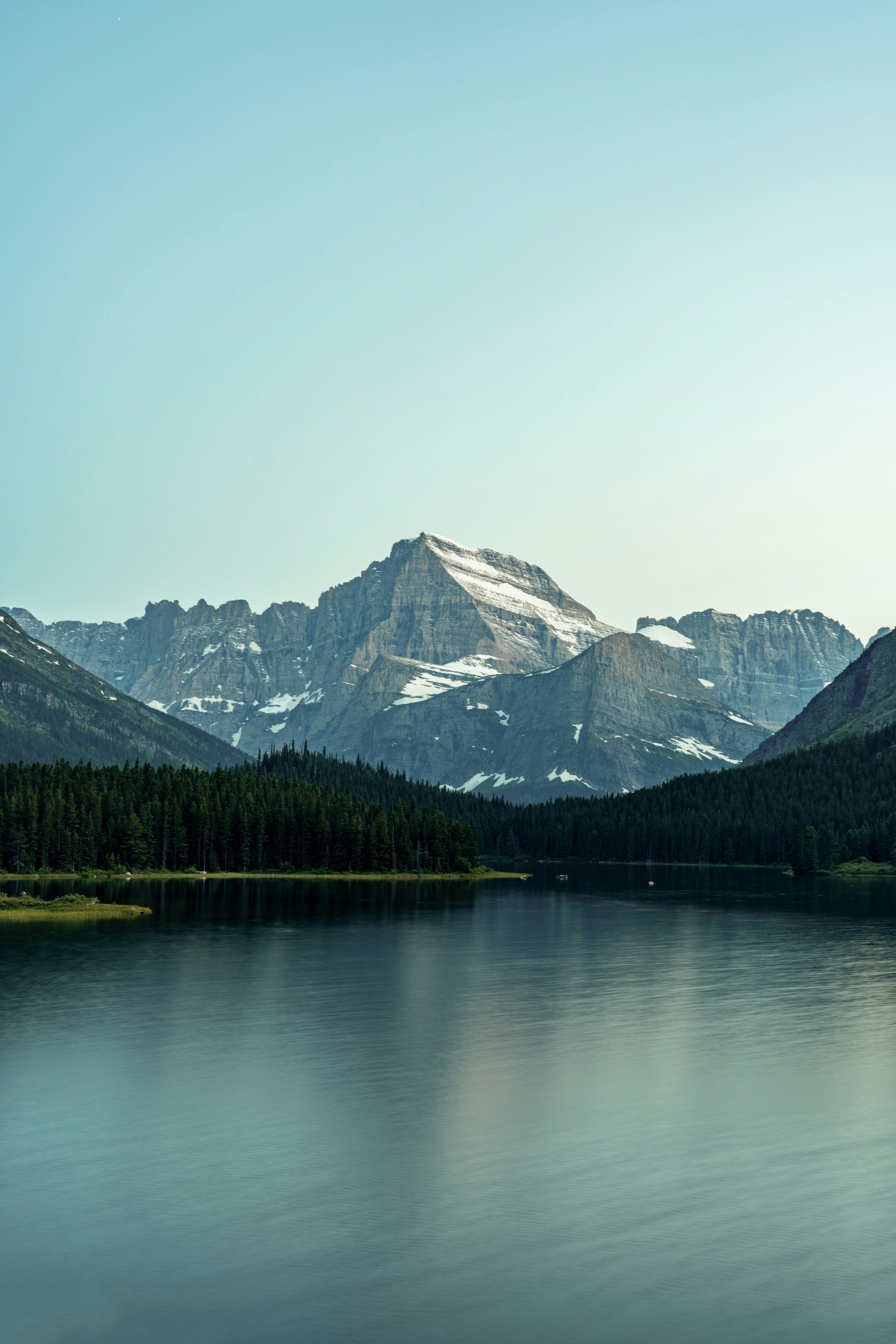 Snow-Capped Sentinel Over a Mirror-Lake Valley