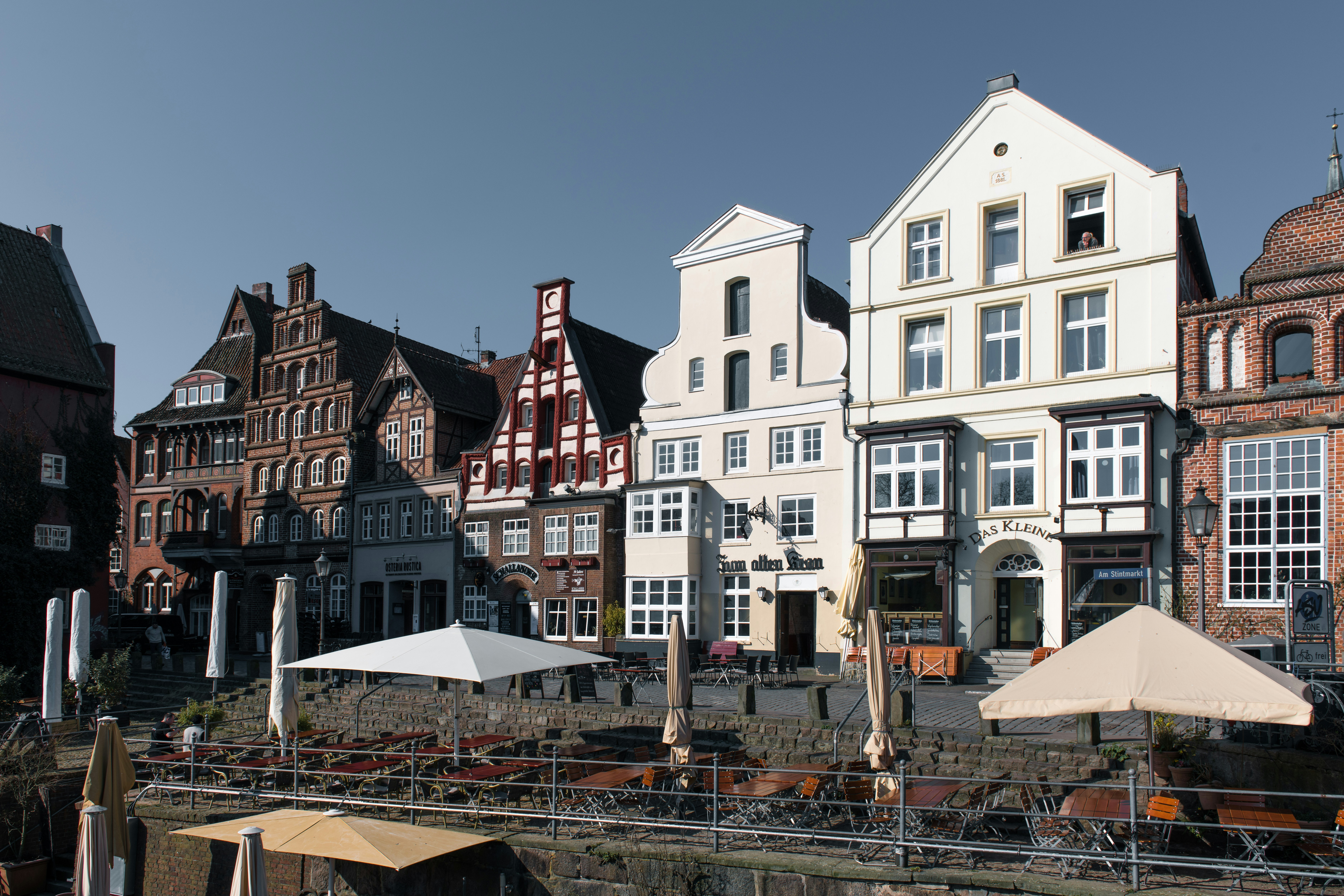 Sunlit Row of Inns Along the Waterfront
