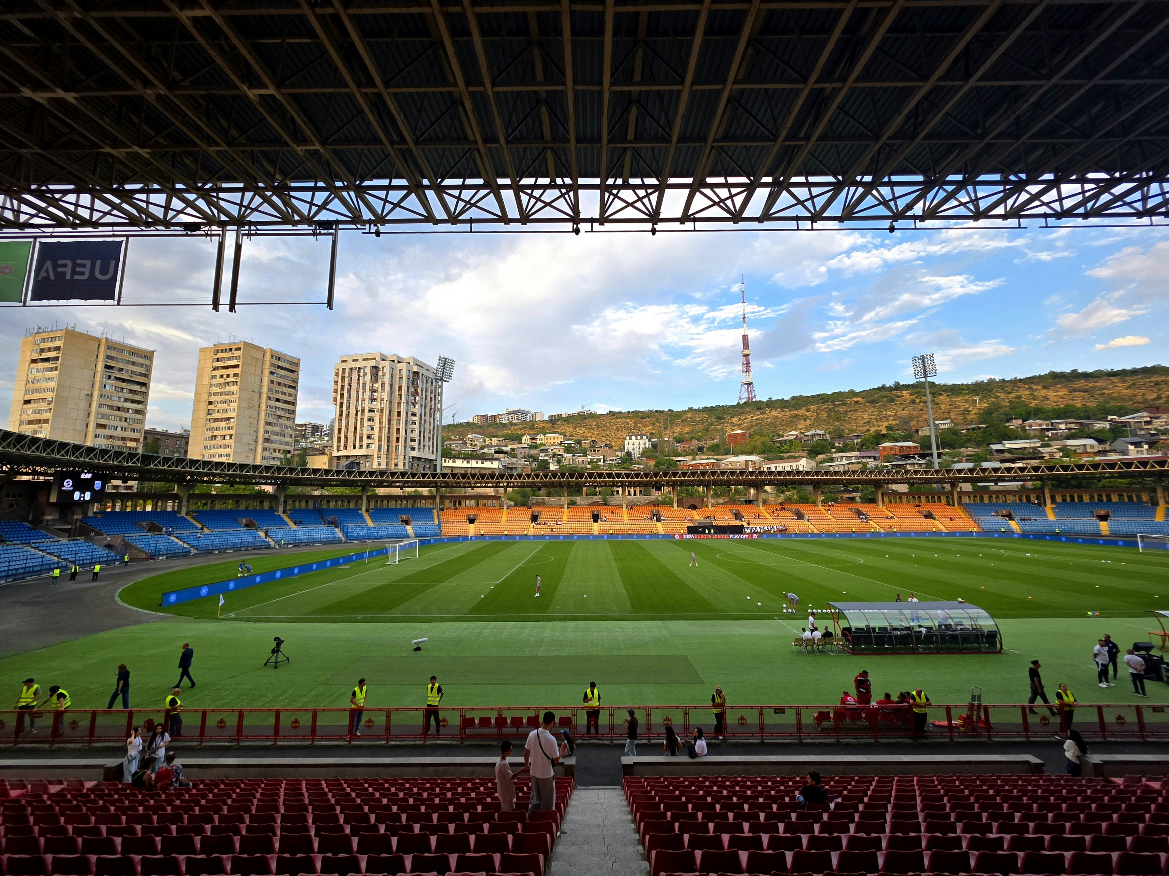 Under the Roof: A Panoramic View of a Stadium Matchday