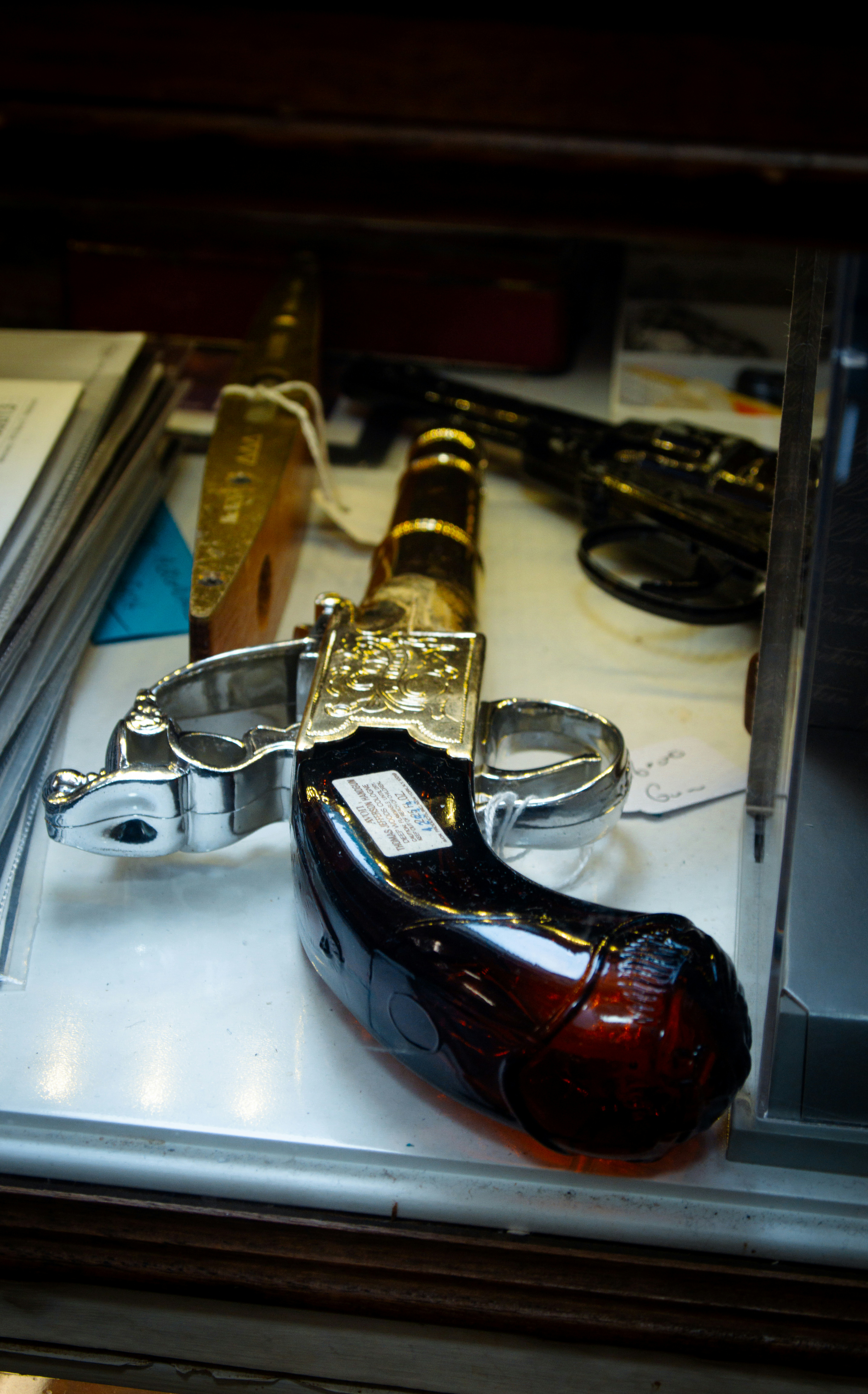 Gunmetal Handle: A Close-Up of the Refined S Line of a Handgun on Display