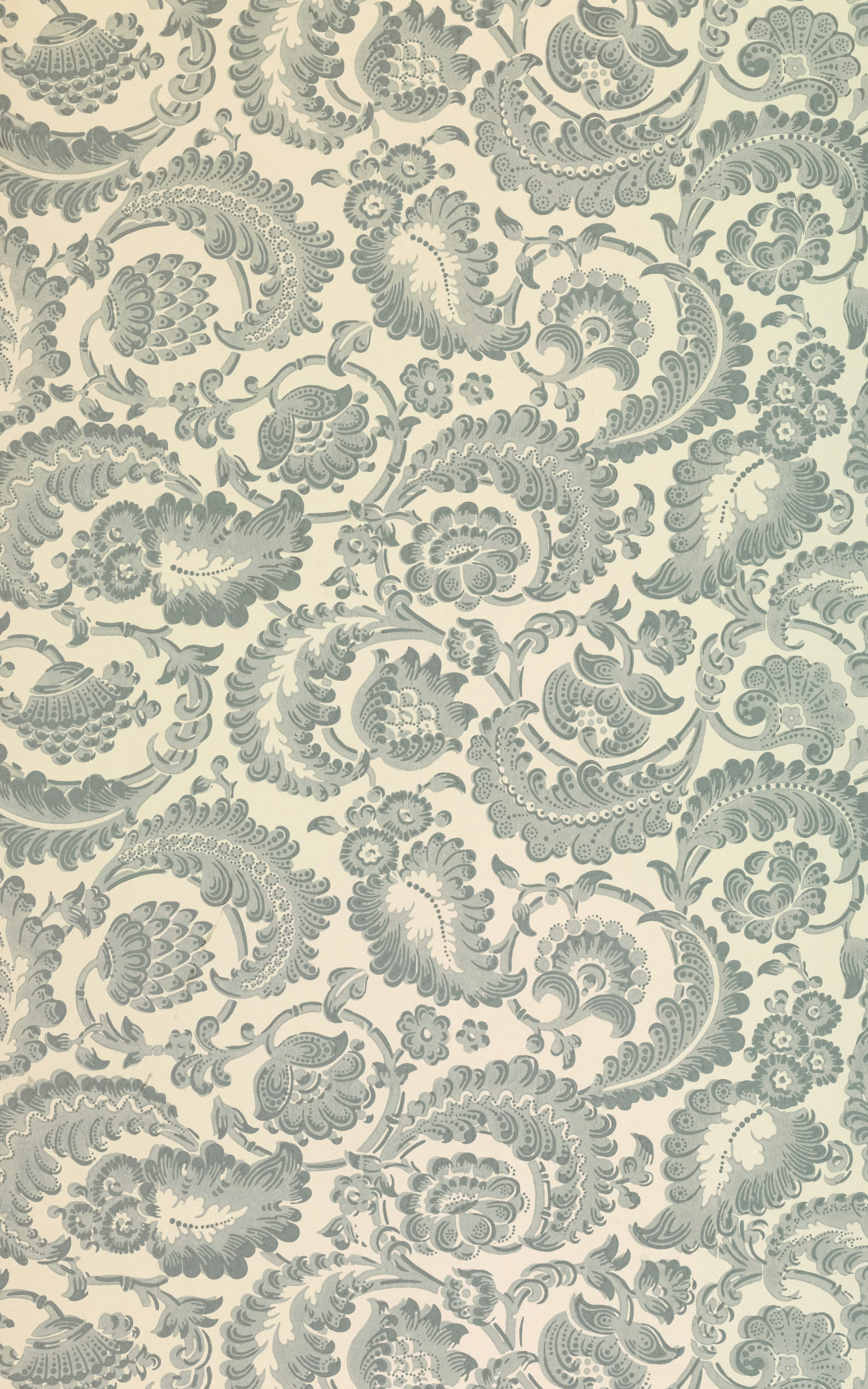 Soft-toned floral paisley wallpaper with intricate scrolls and blossoms in muted blue-gray on a cream background. A decorative textile-like pattern suitable for interiors.
