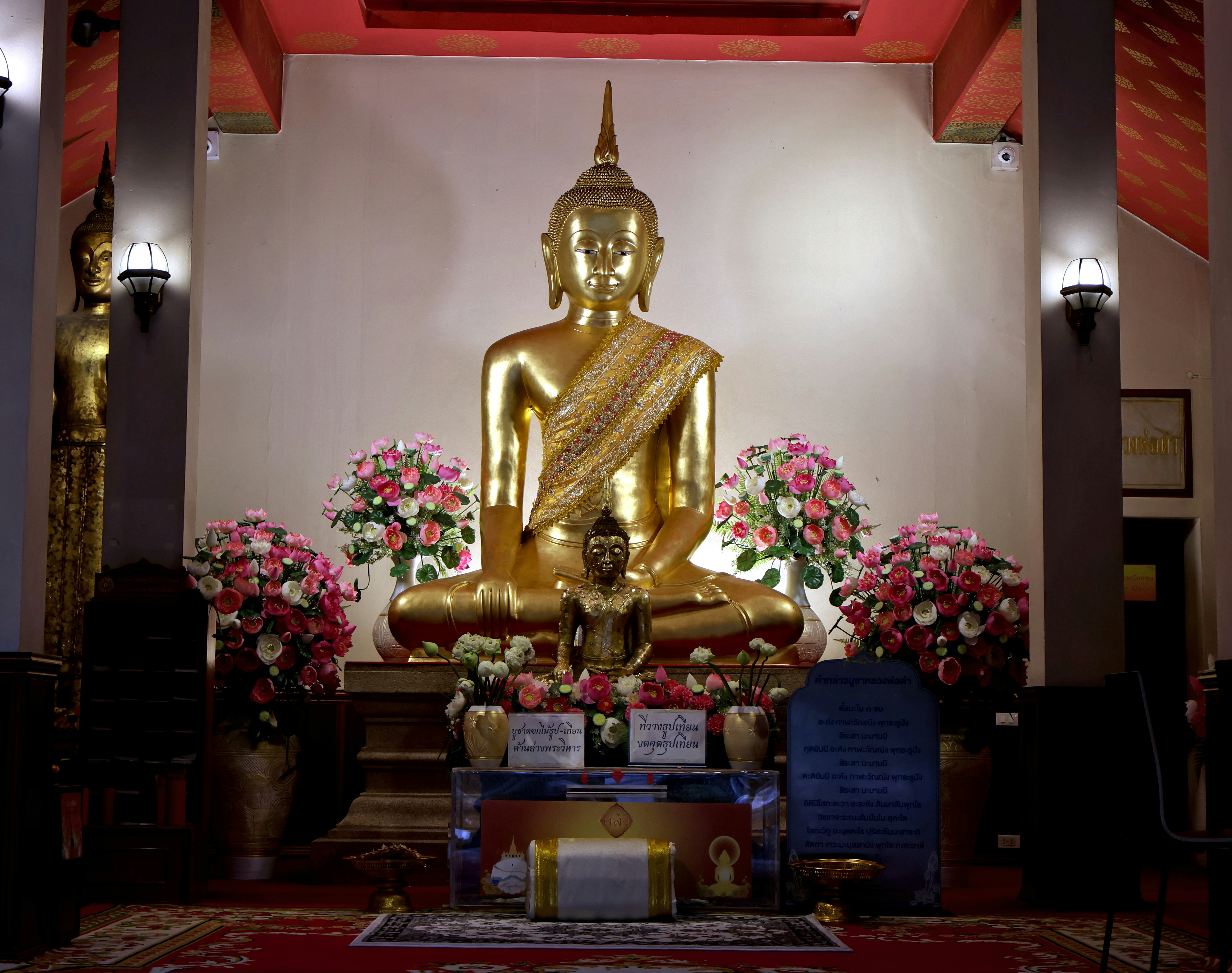 Golden Buddha Shrine: Center of Serenity in a Floral Hall
