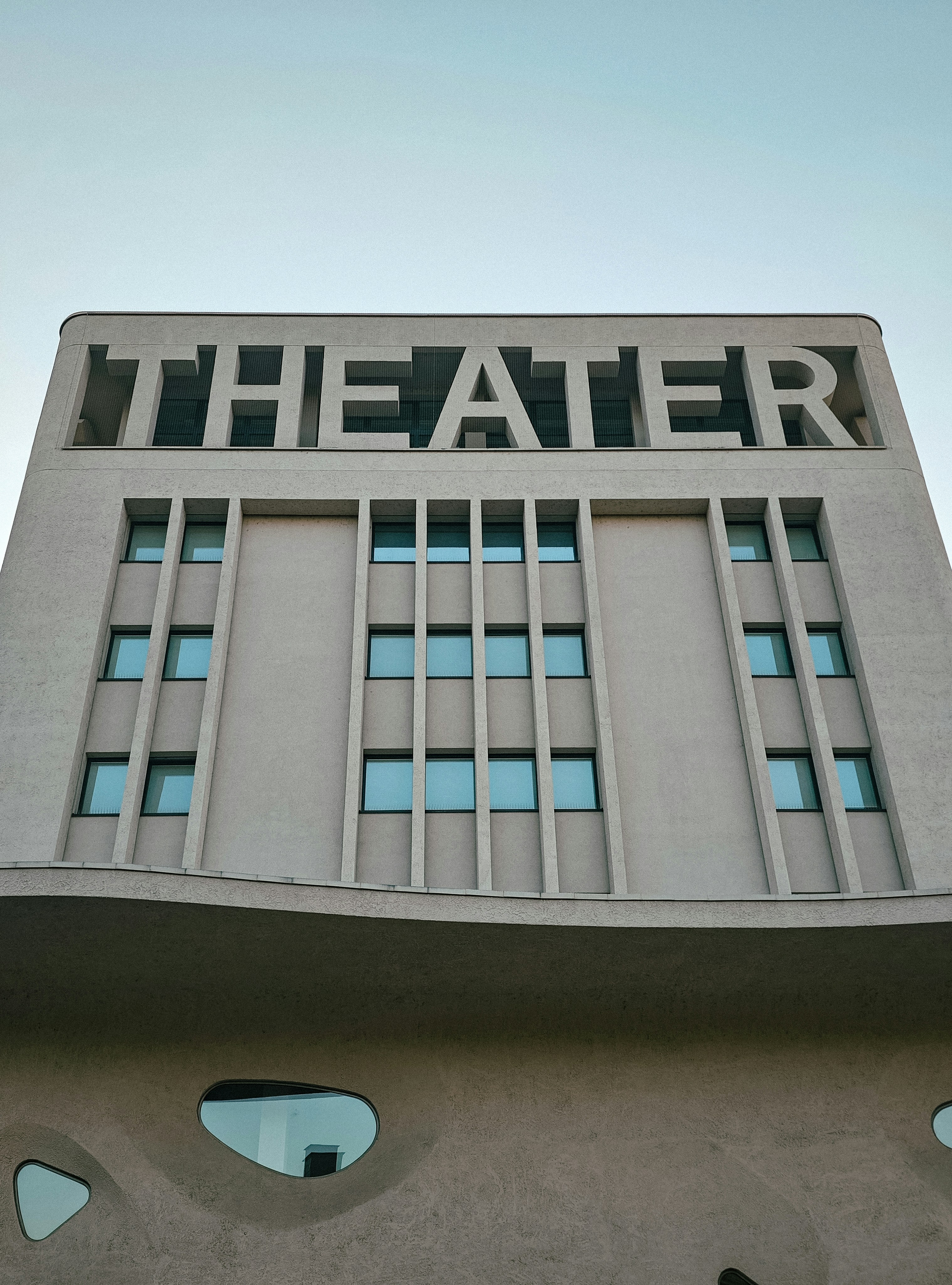 Theater Frieze: Concrete Elevation of Light and Shadow