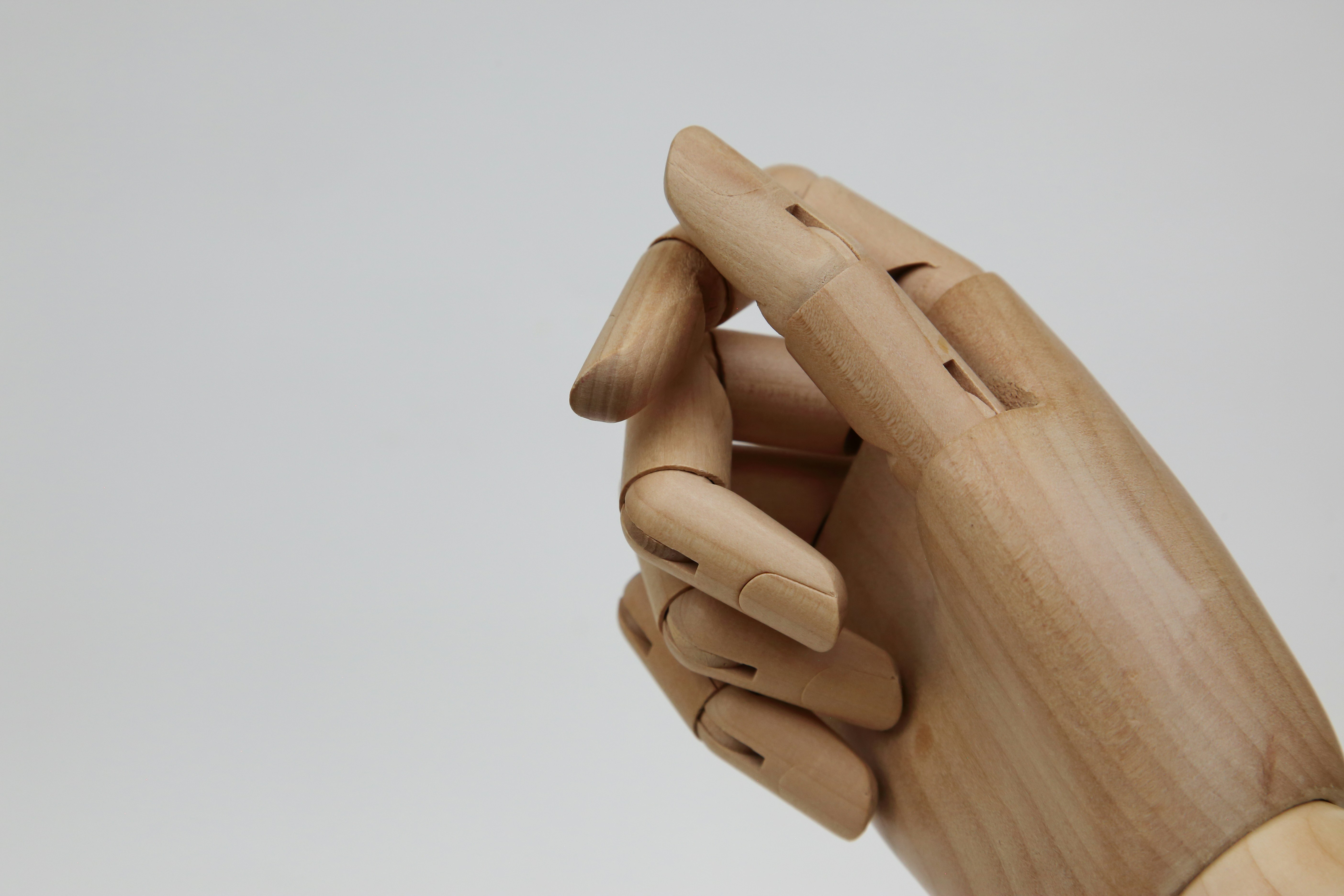 A gesturing wooden hand