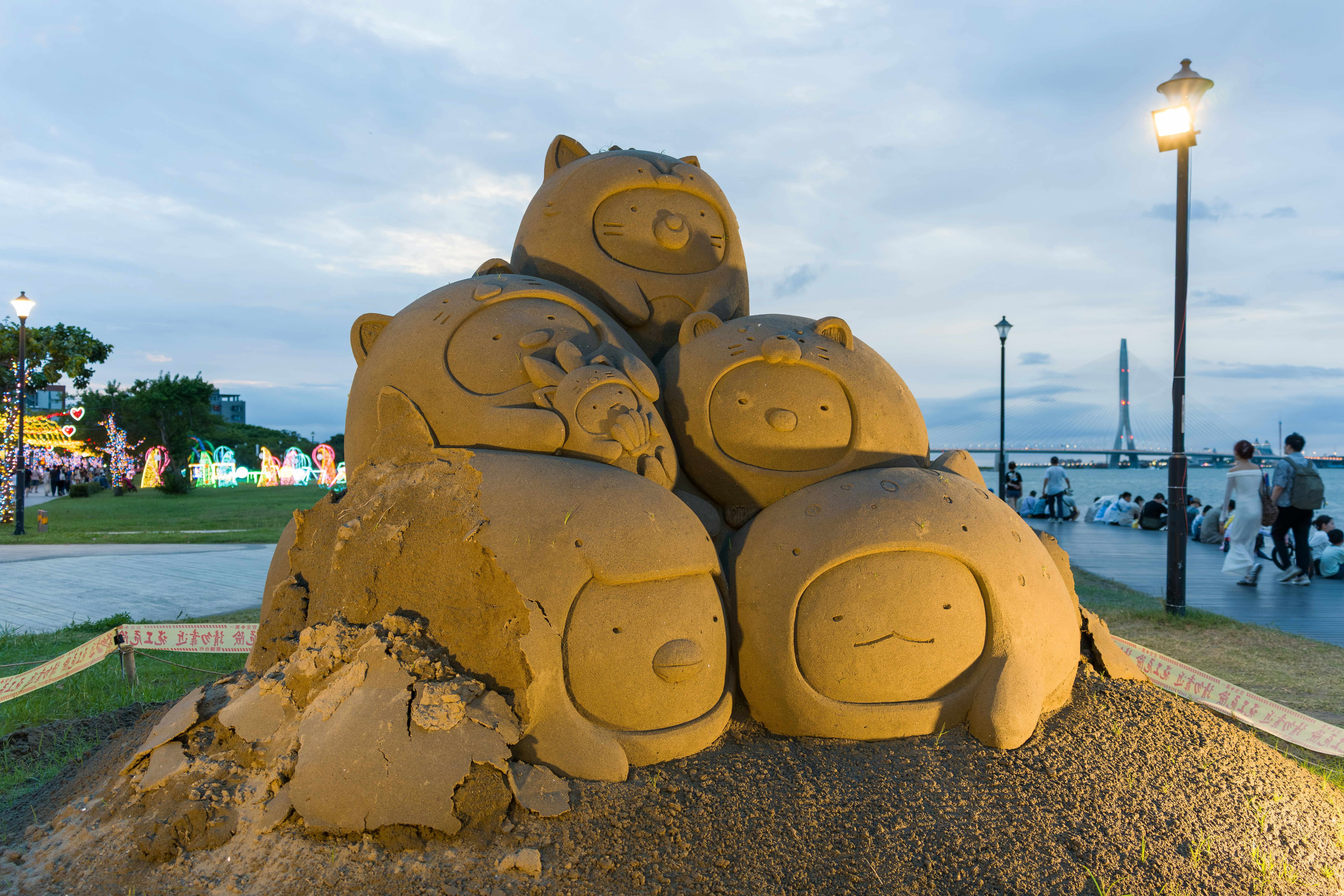 Whimsical Sand Guardians Stand Watch Over a Sea-Breeze Boulevard