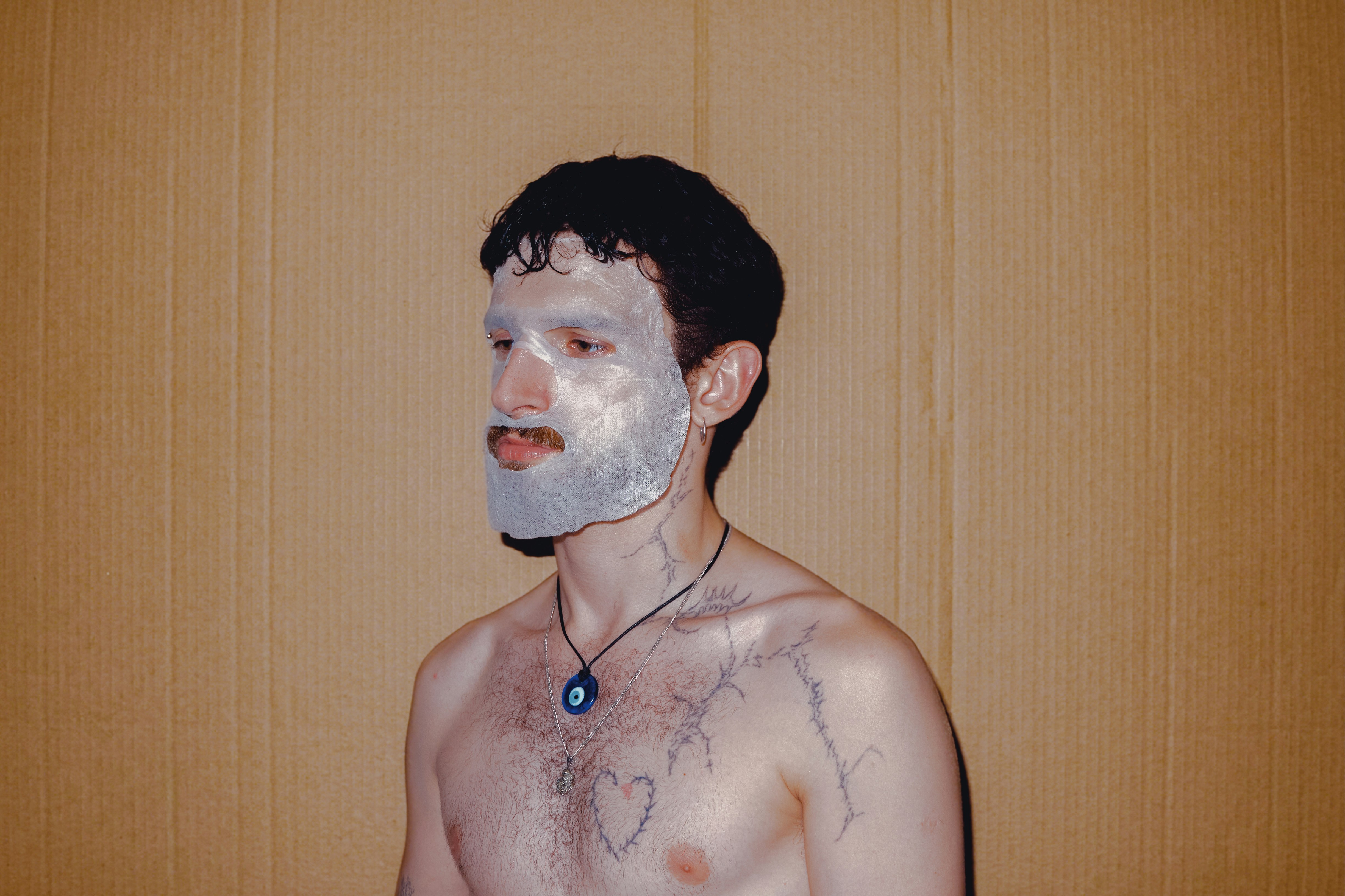 Face Mask Revelation on a Midnight Portrait