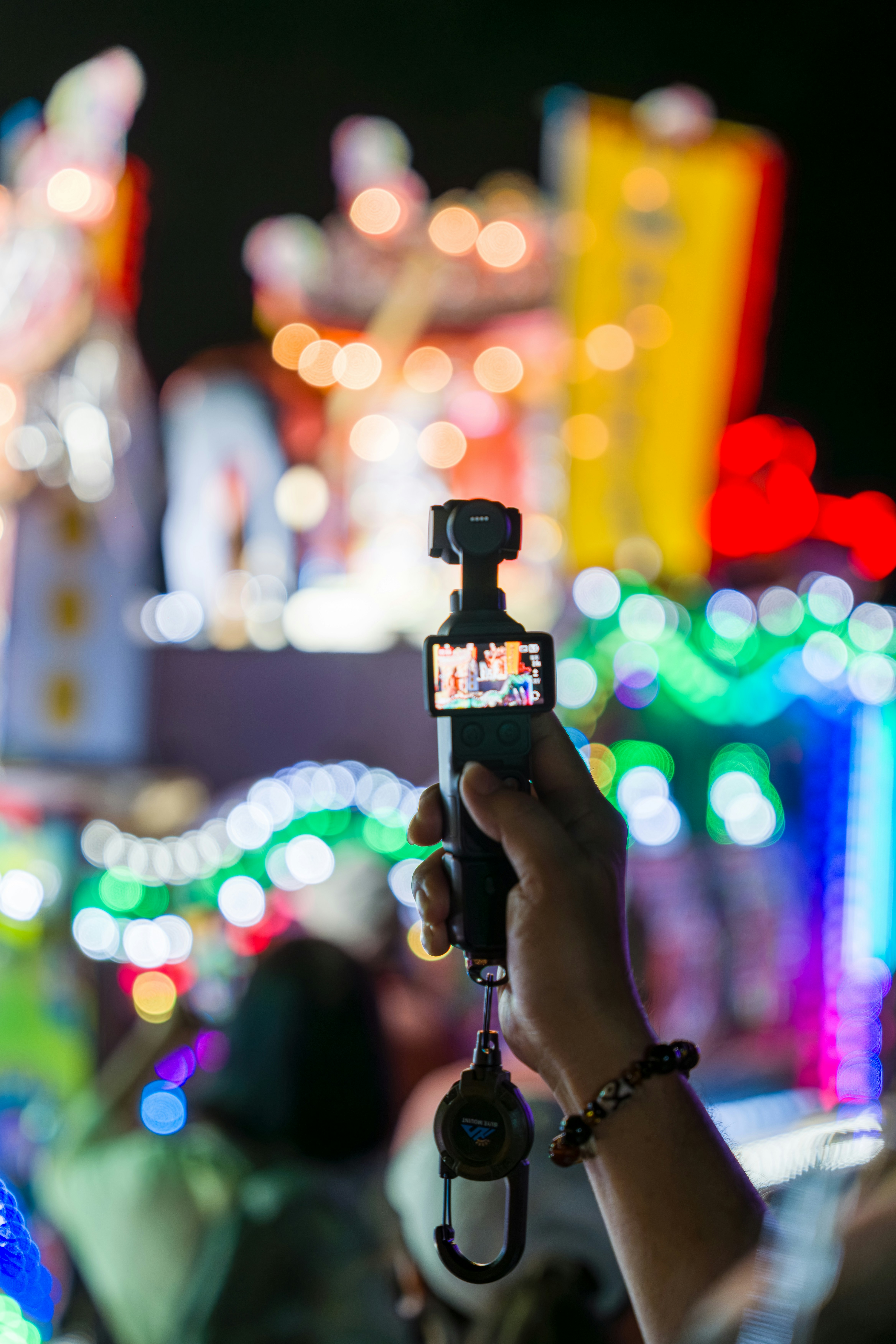 Shutter Held High Over Neon Nightscape