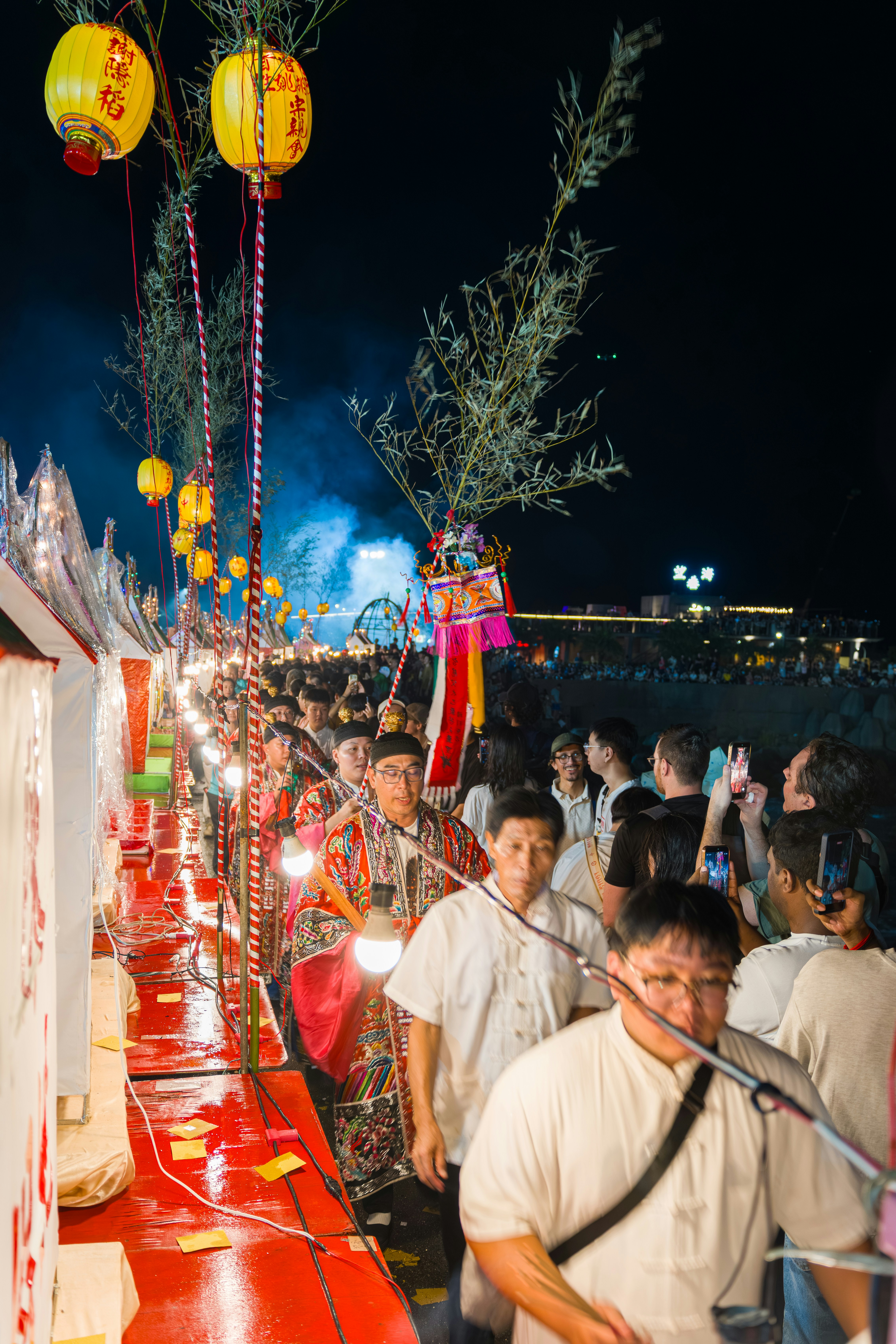 Lantern Procession Along a Luminous Night Market