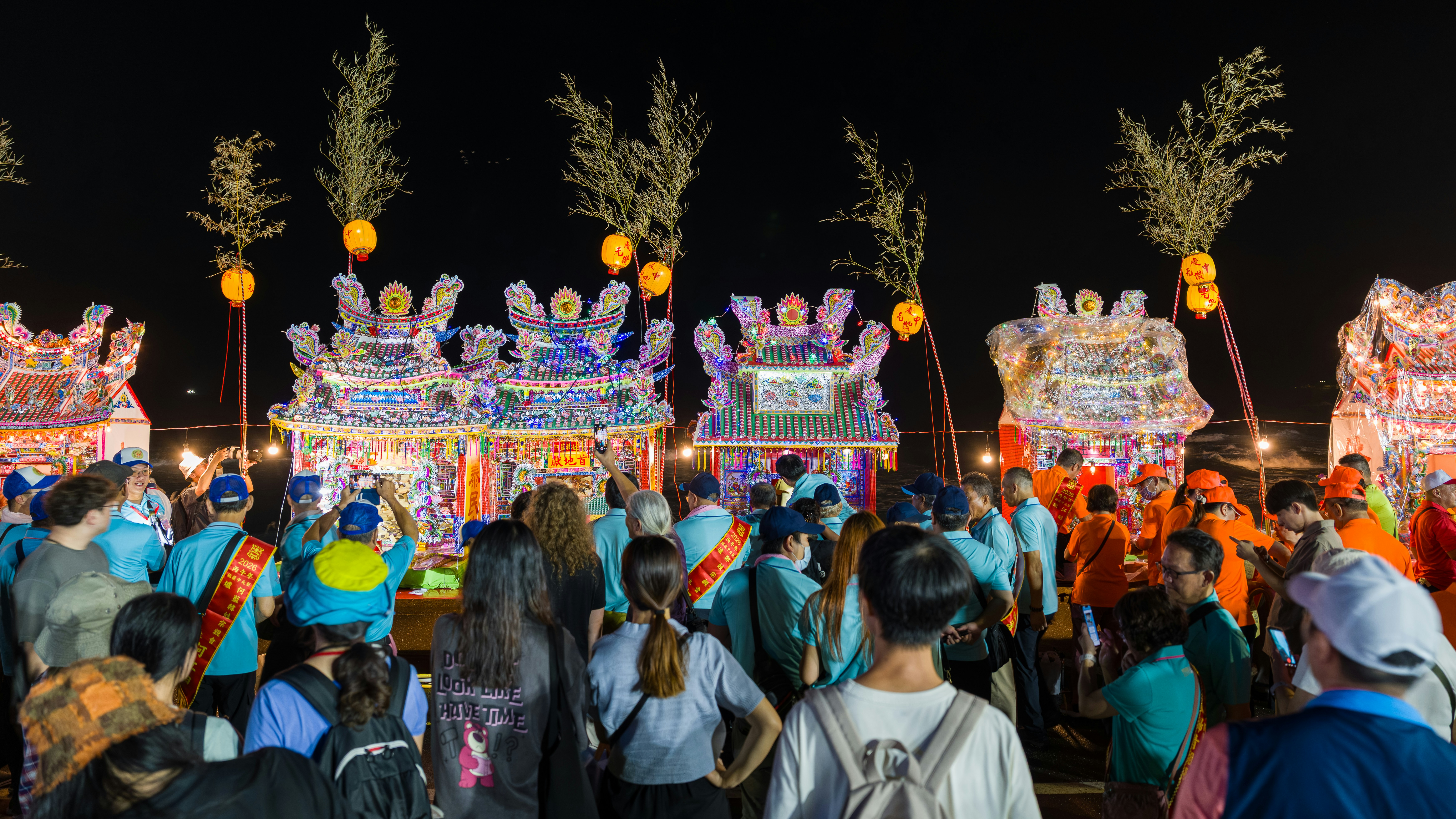 Night Lantern Parade: Illuminated Temples Rise Above a Sea of Crowd