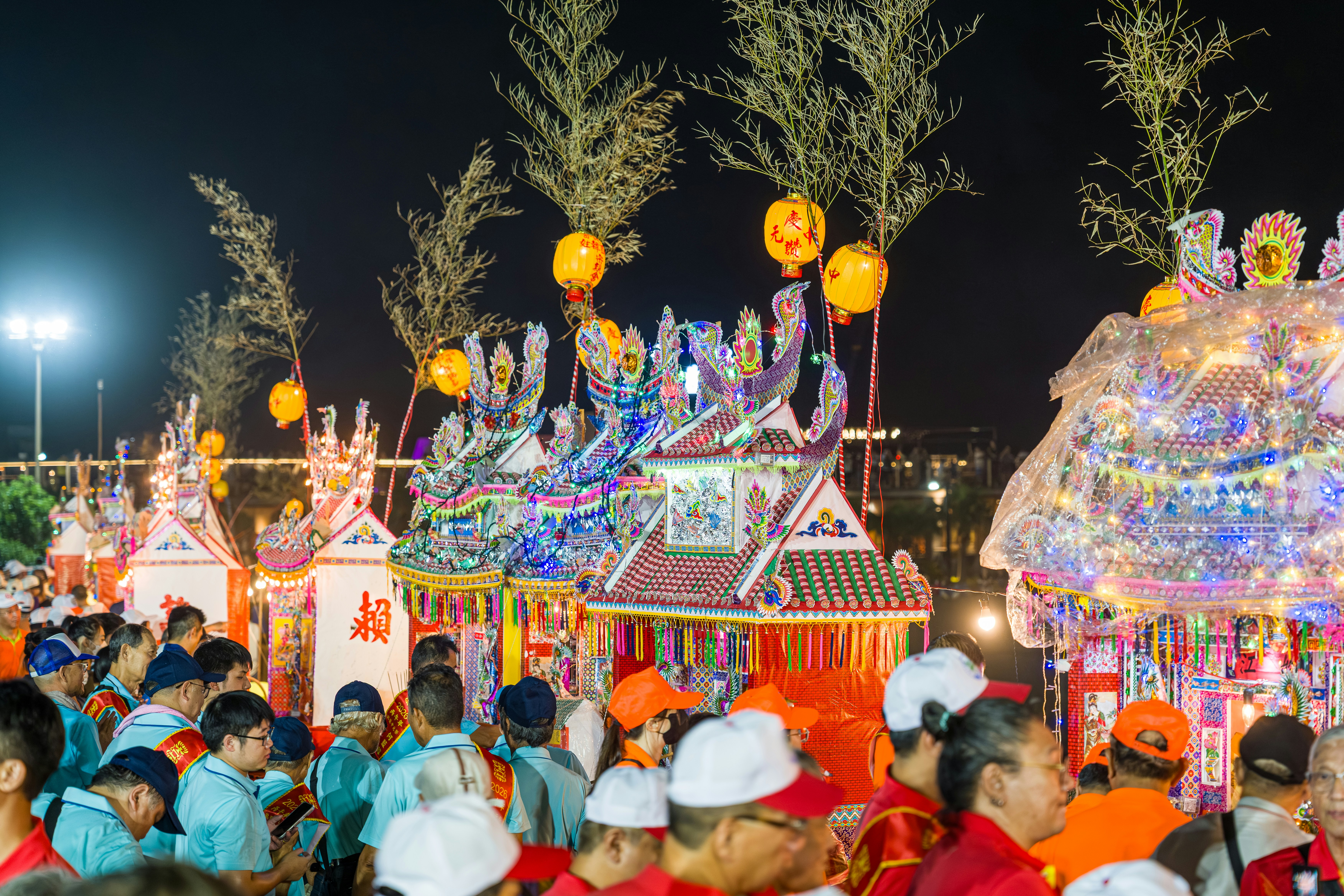 Lantern-lit Parade Floats Gliding Through Night Market