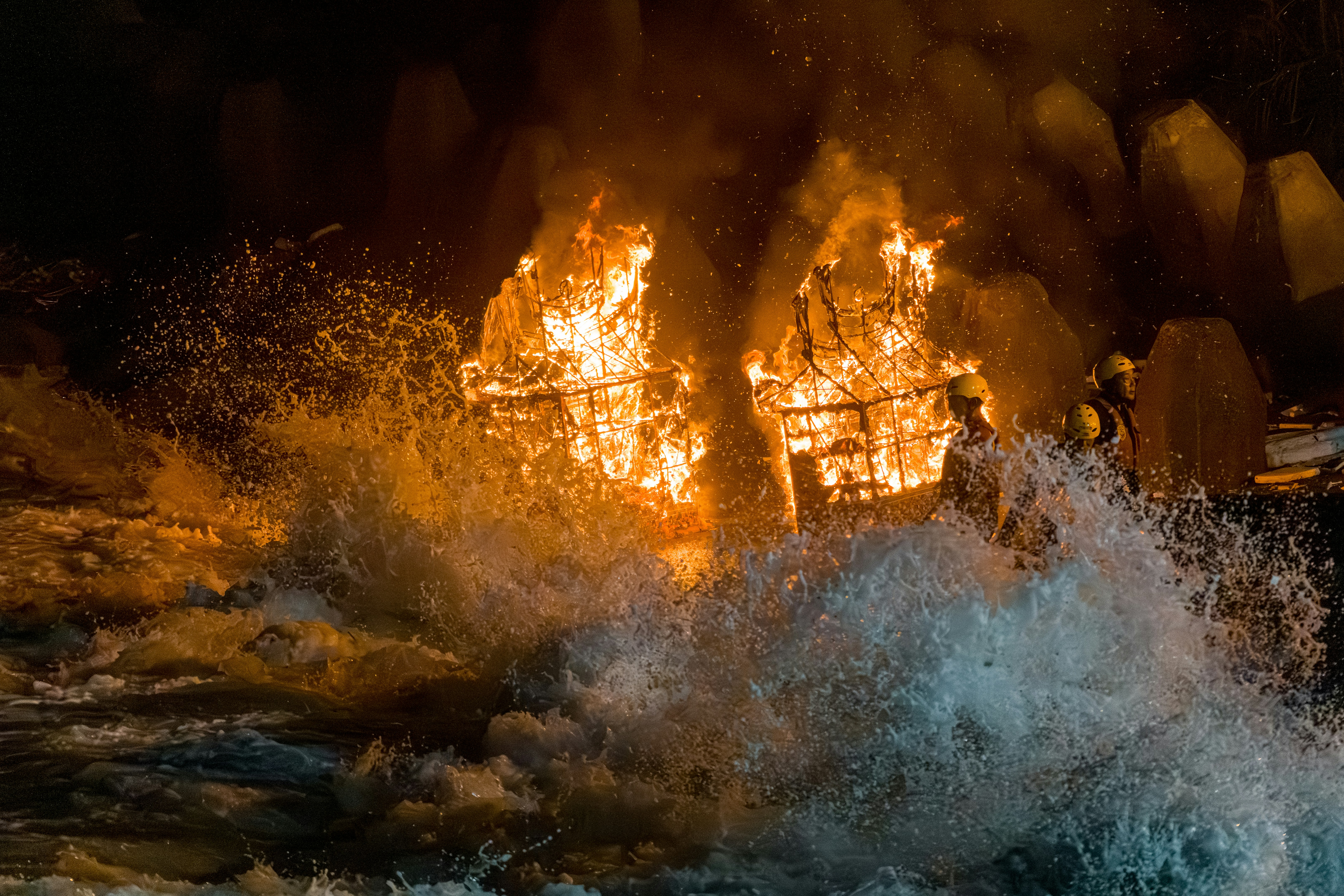 Fiery Rift: Figures at the Edge of the Breaker