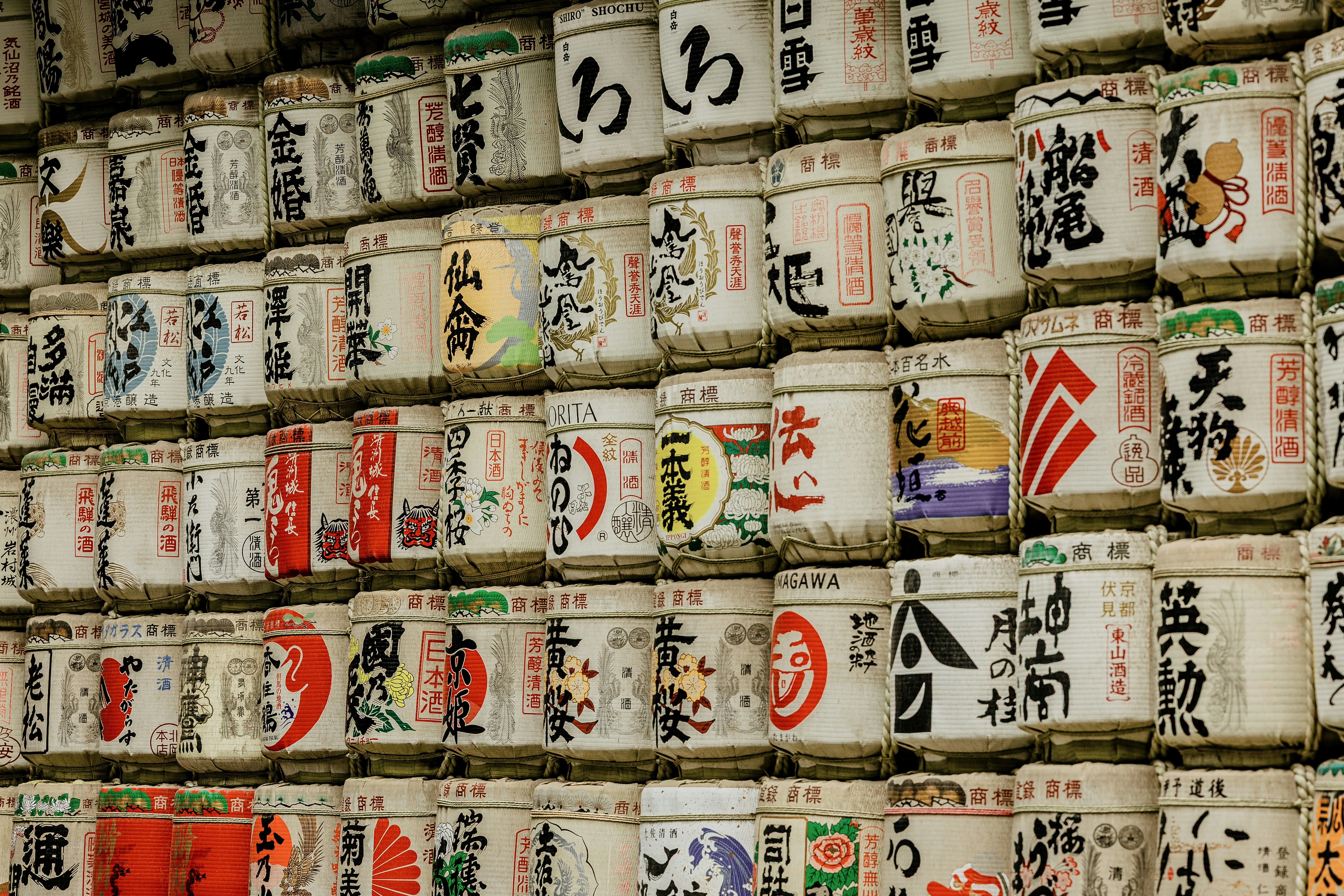 Rows of Painted Sake Casks: A Tapestry of Tradition