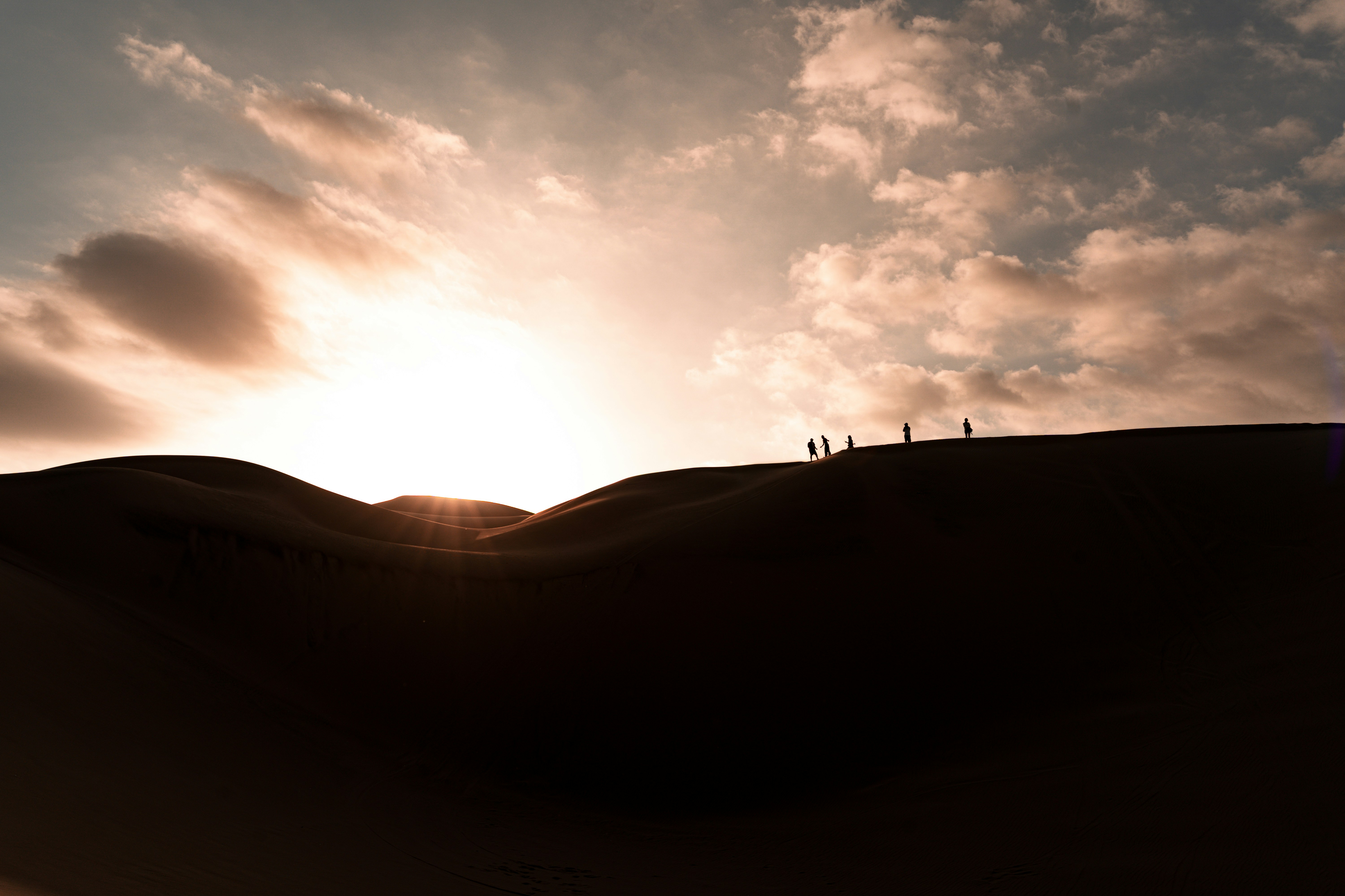 Silhouetted Dune Walkers at Dusk